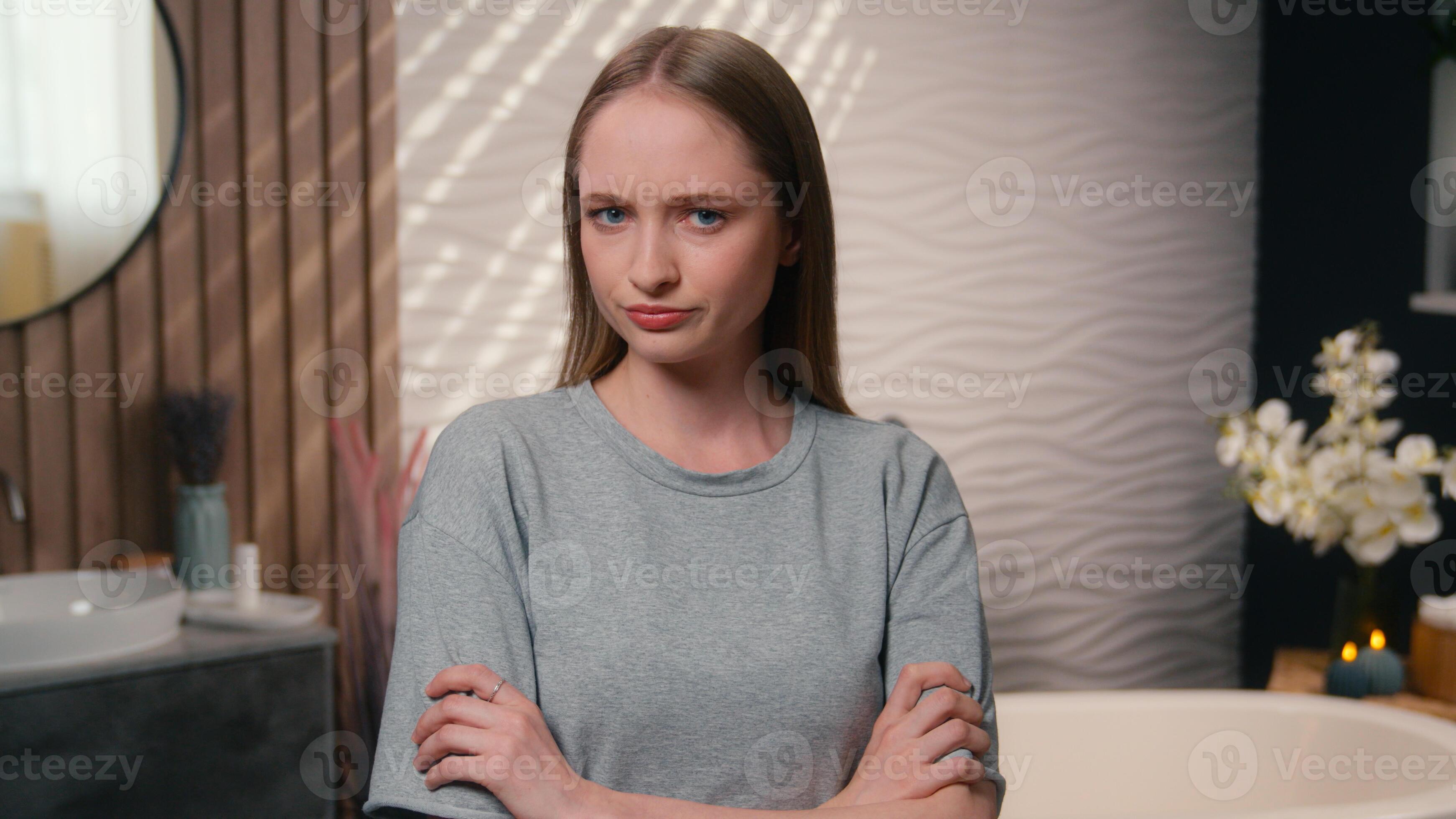 Female portrait in home bathroom sad displeased offended woman ...
