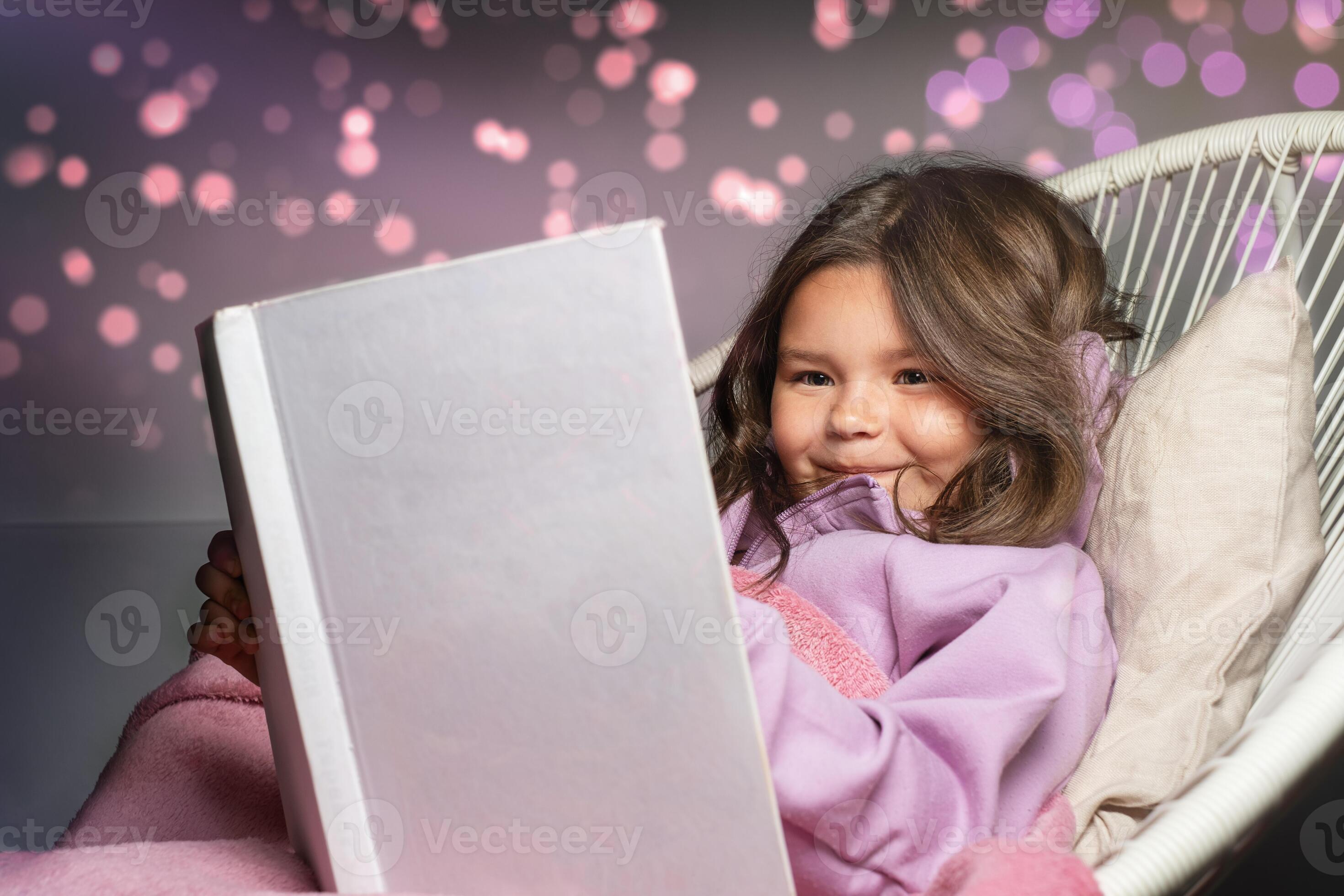 A child reads fairy tales in a chair 53761242 Stock Photo at Vecteezy