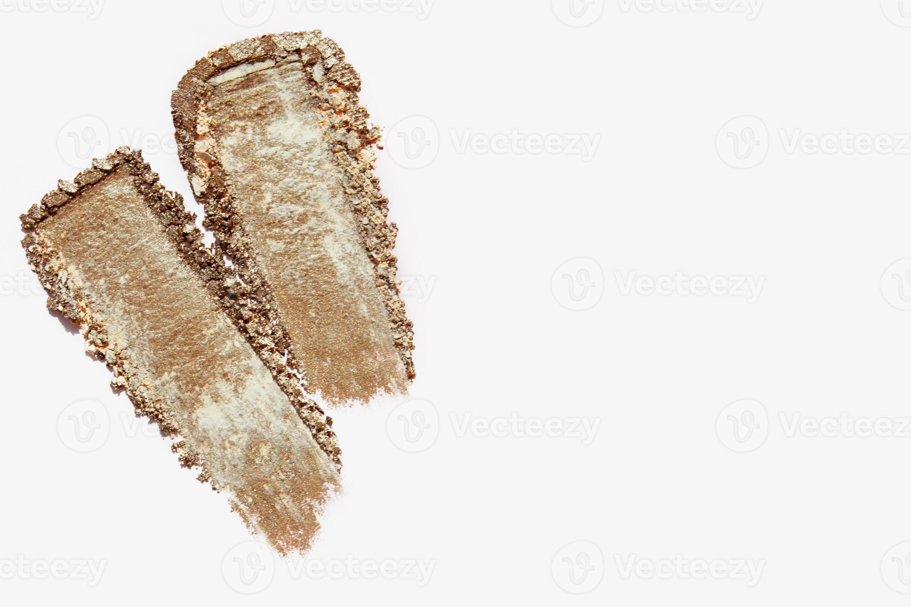 Bronze and beige eyeshadow texture swipe with empty space on a light white background. Cosmetic ...