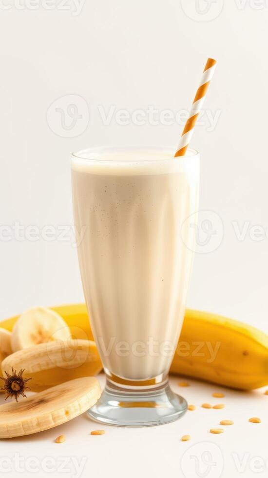 Creamy banana milkshake in a tall glass with fresh bananas on a light background 53842390 Stock ...