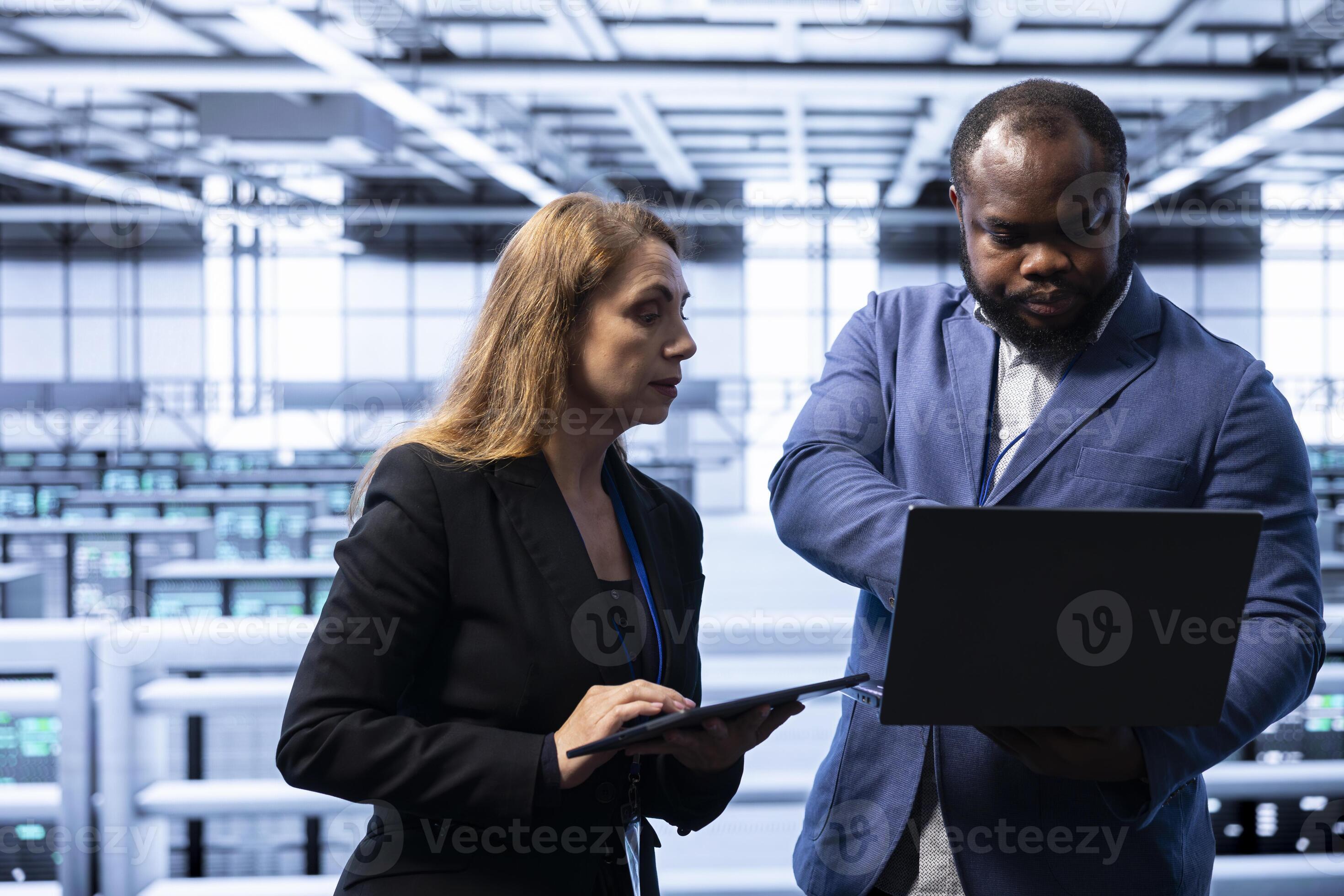 Data center teamworking colleagues ensuring safety and security of database. Cybersecurity team ...