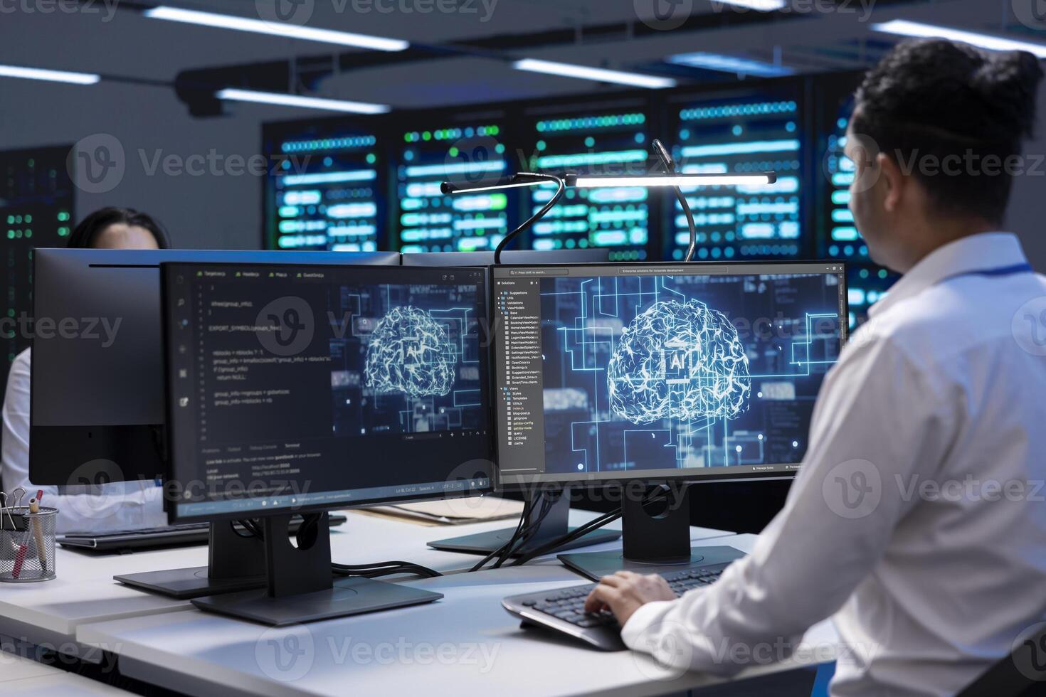 Computer scientist working in data center providing computing resources needed for artificial ...