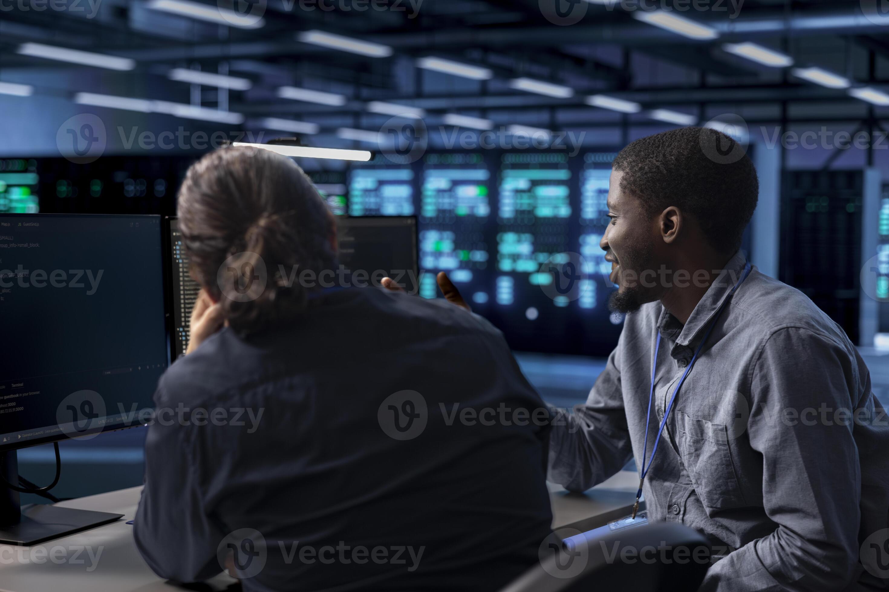 Teamworking Colleagues Reconfiguring Server Farm To Optimize It For Data Processing Requirements