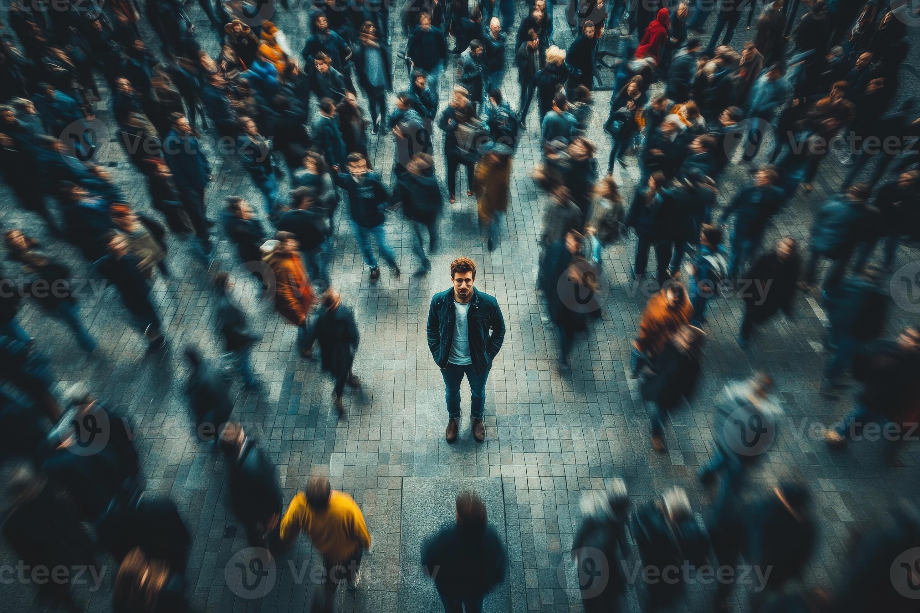 Man standing alone in a bustling crowd during a noir urban evening ...
