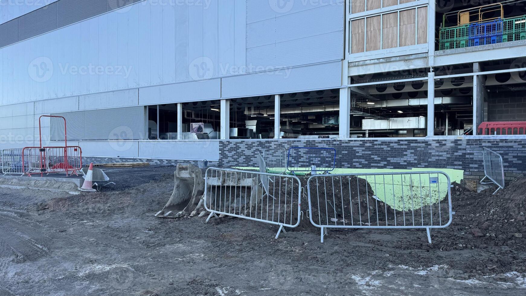 Partially Completed Building Exterior with Construction Materials ...