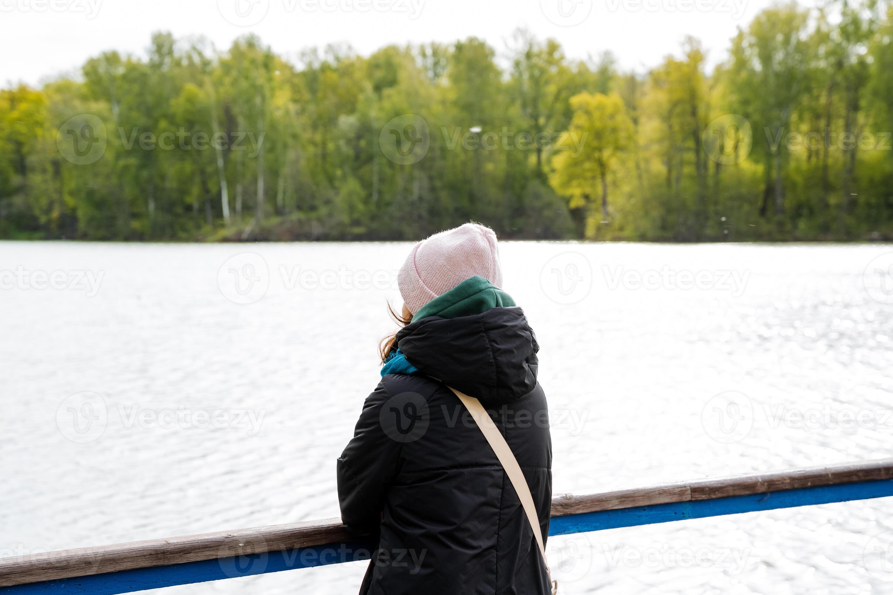 Woman by the lake admiring the tranquil landscape in the Lake District 54819668 Stock Photo at ...