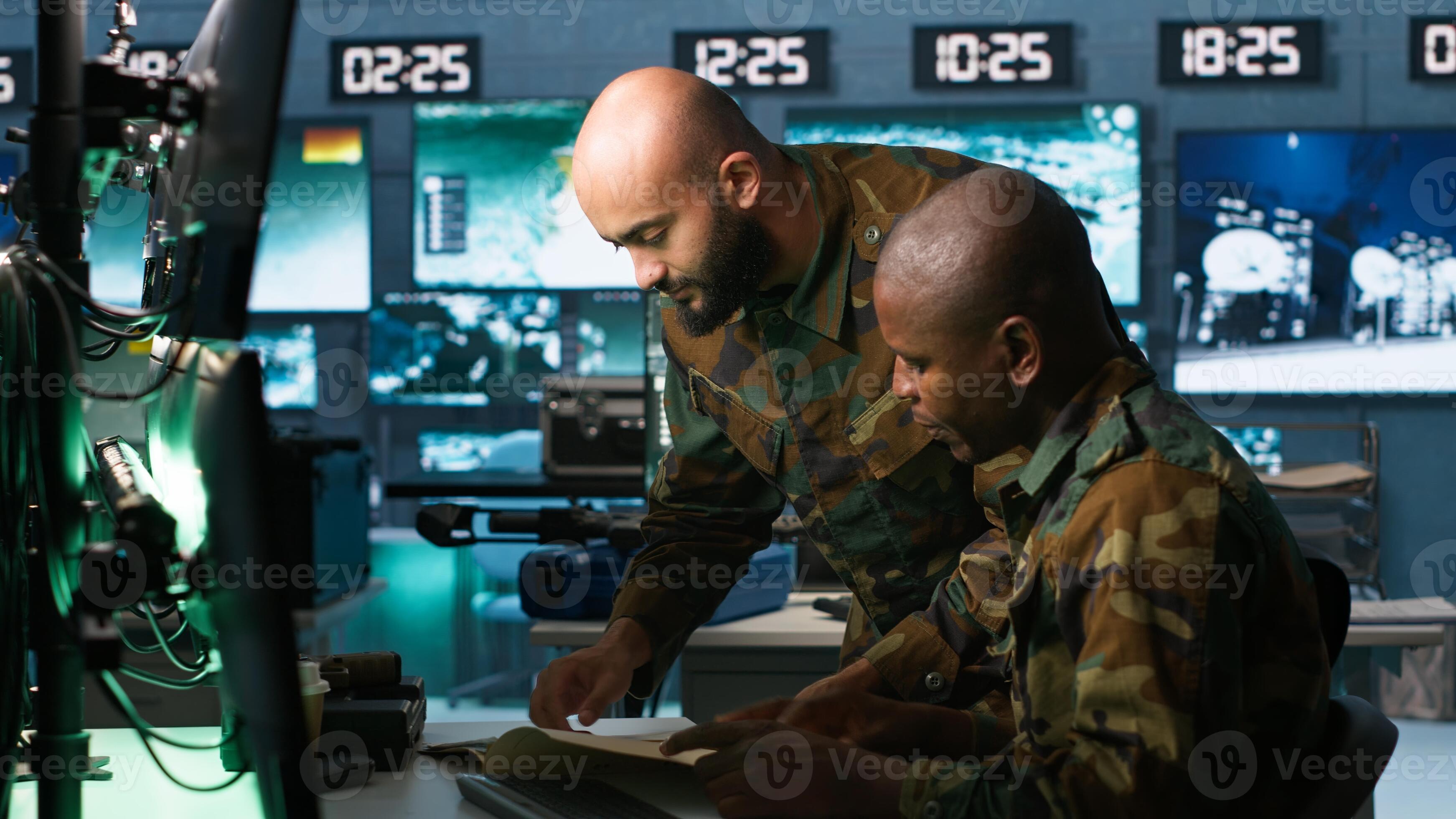 Team of military officers in command center look at intel folder files on enemy battle formation ...