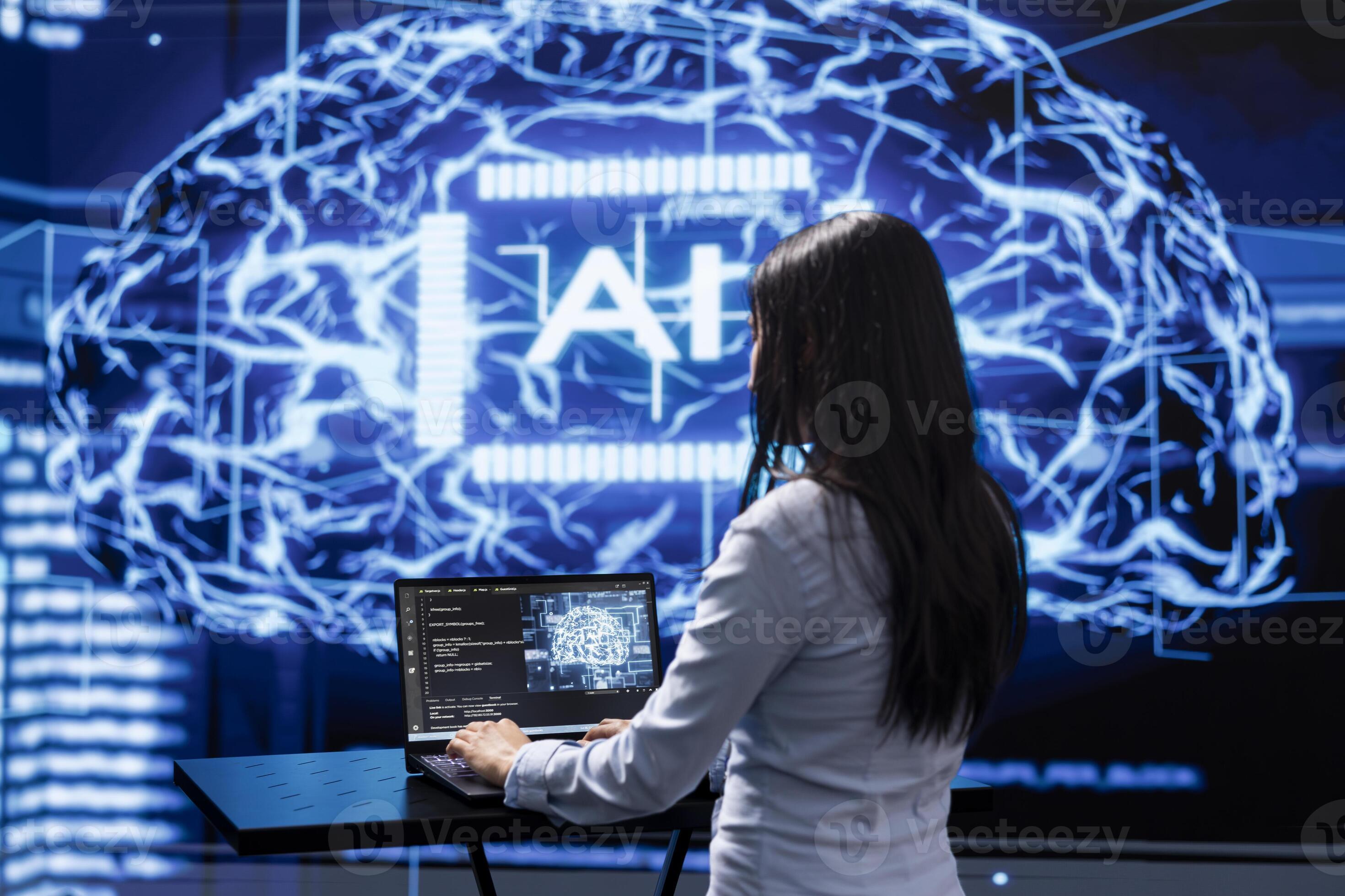 Programmer analyzing complex AI brain models on laptop, running simulations. Female employee ...