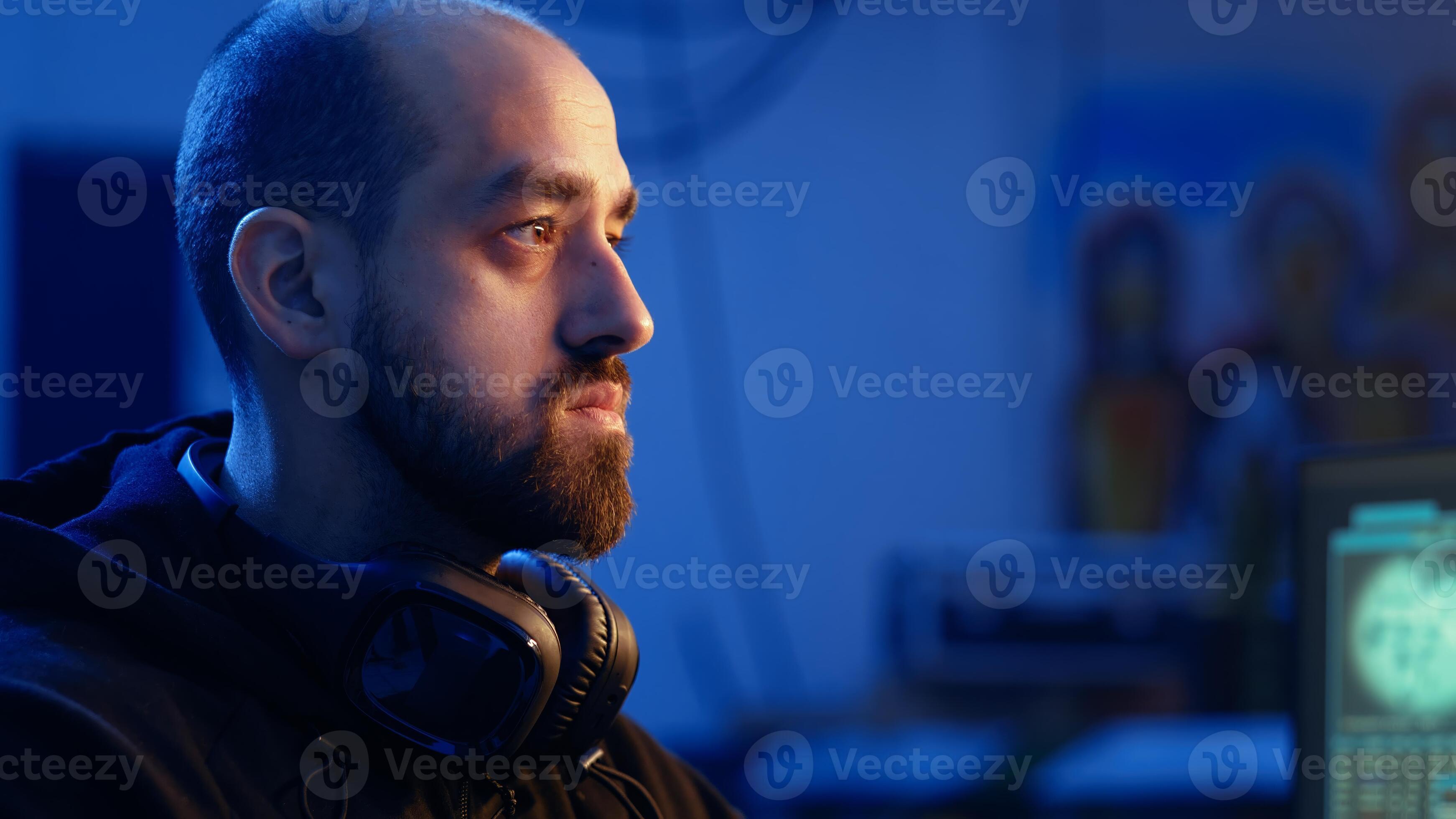 Hacker Hiding In Underground Bunker Looking Over His Shoulder And
