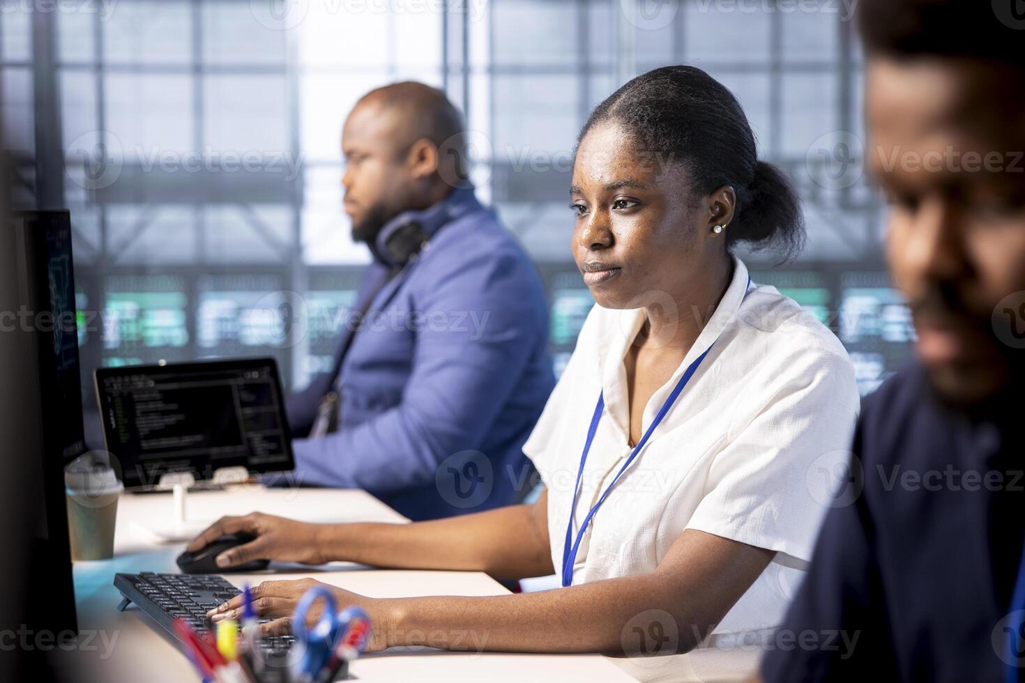 African American Developer In Data Center Workspace Using Diagnostic Tools And System Monitoring