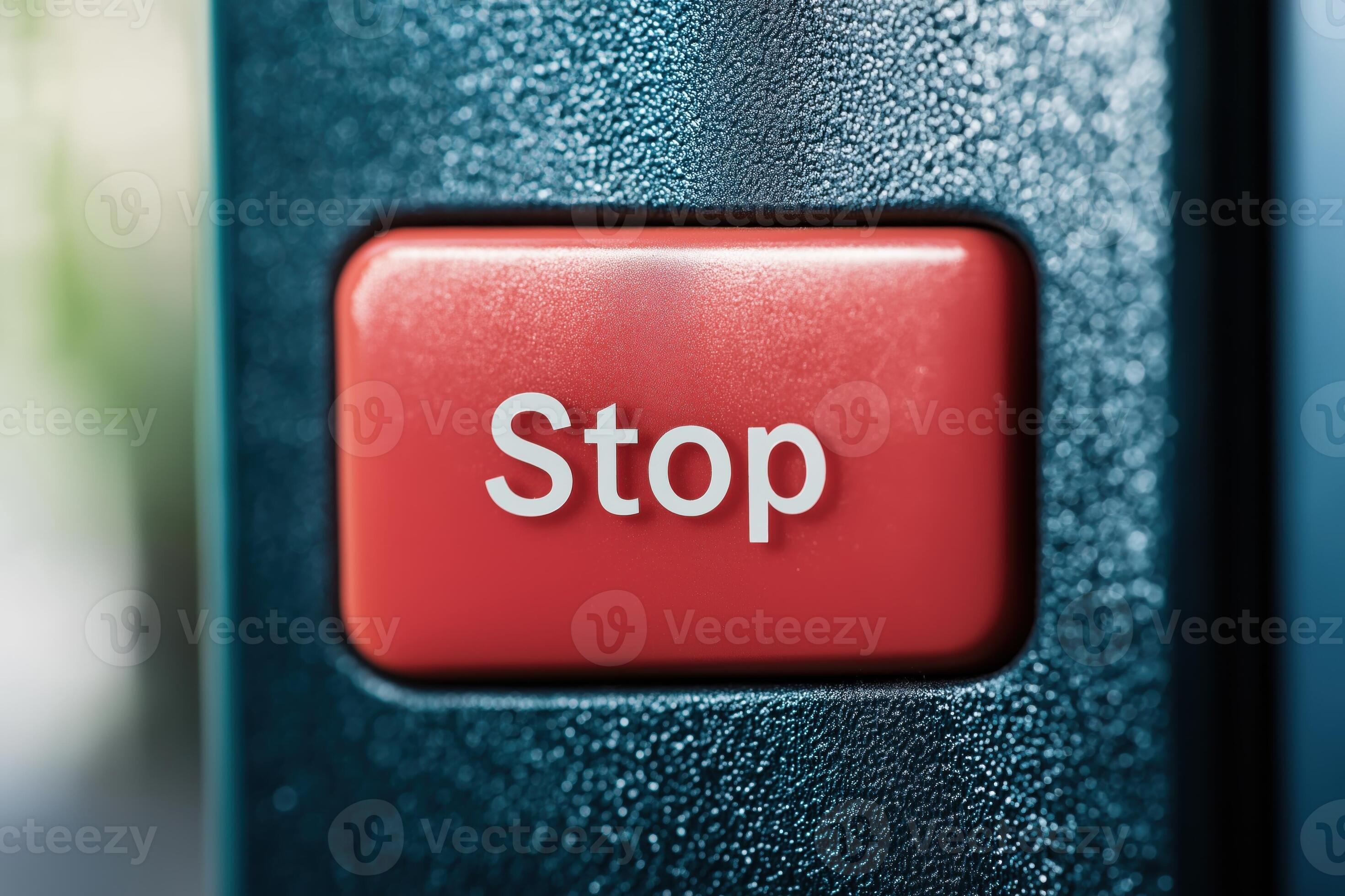 Close-up of a red stop key on a black keyboard with faded colors ...