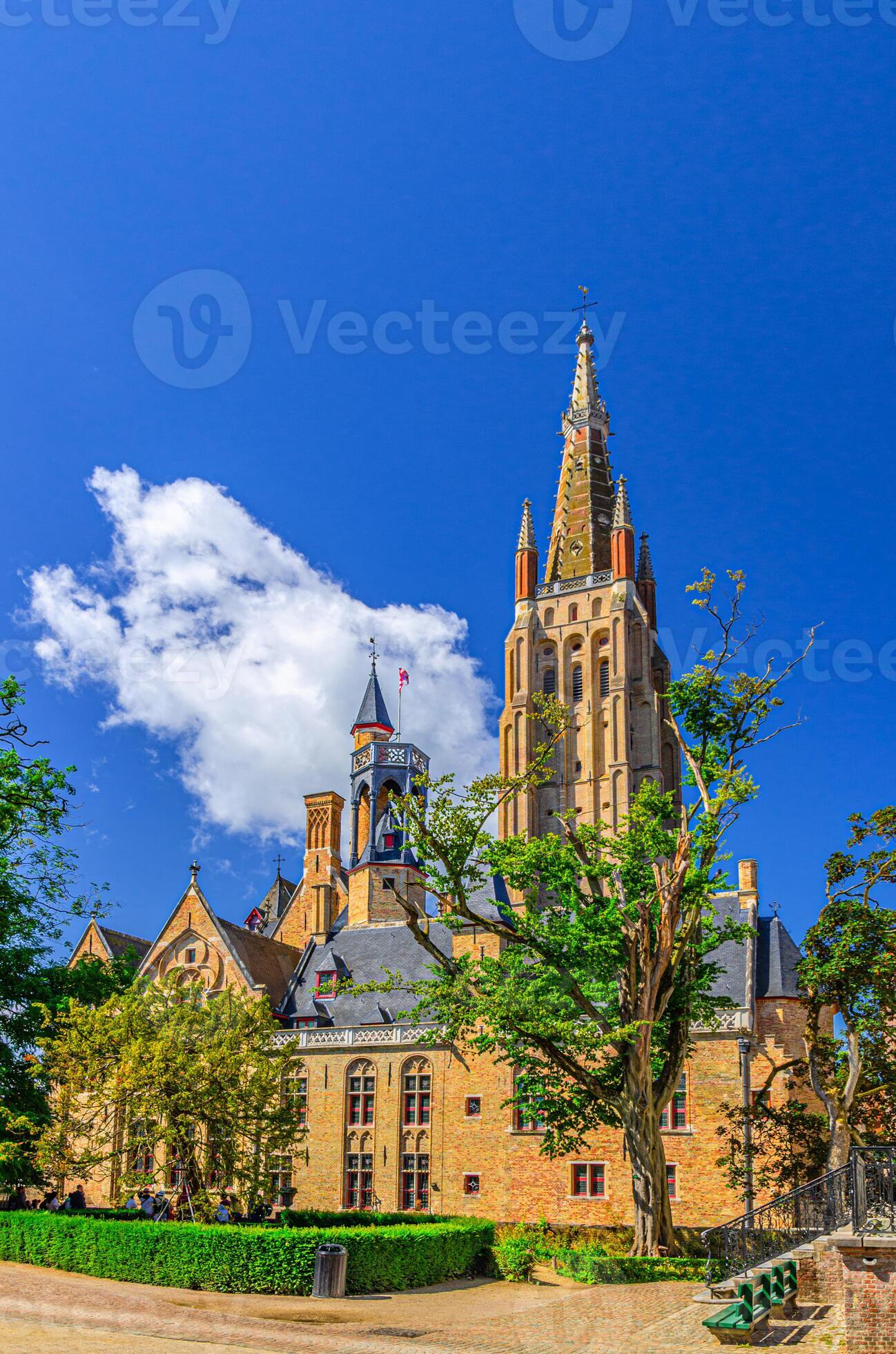 Roman Catholic Church of Our Lady Gothic style building with tower and cross on spire, Onze ...