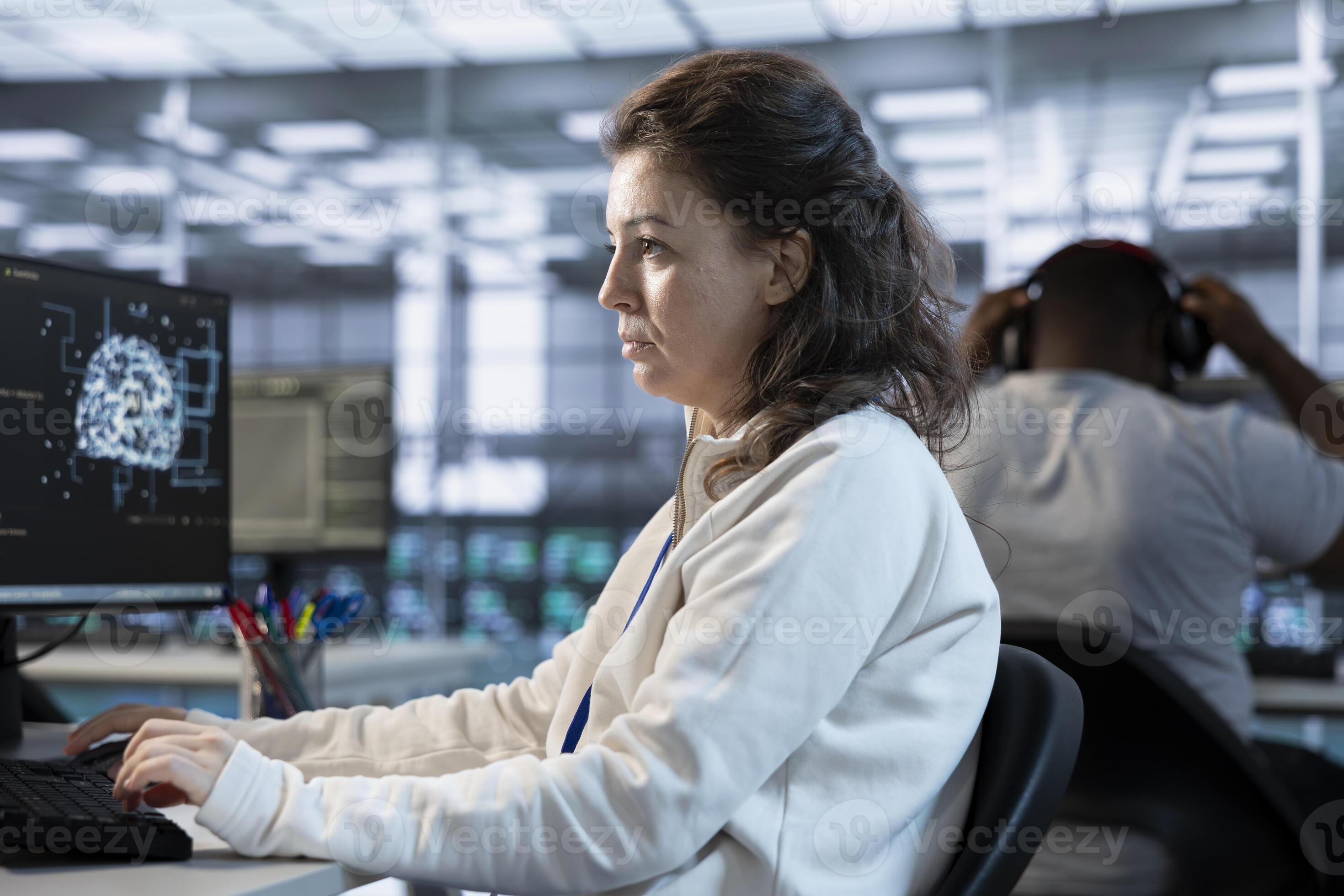 Computer scientist programming in AI data center used for machine learning training. IT ...