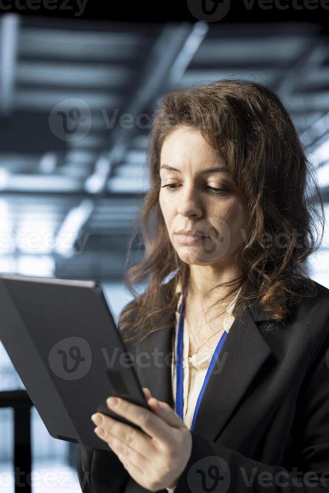 Technician In Data Center Workspace Using Tablet Configuring Network Virtualization Woman In