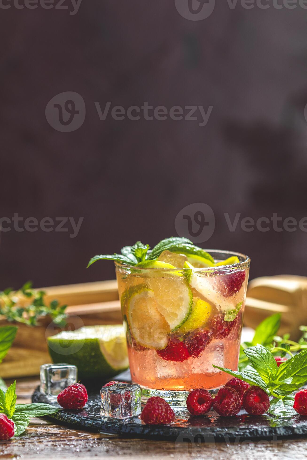 Refreshing raspberry and citrus infused summer cocktail with ice and mint 55580513 Stock Photo ...