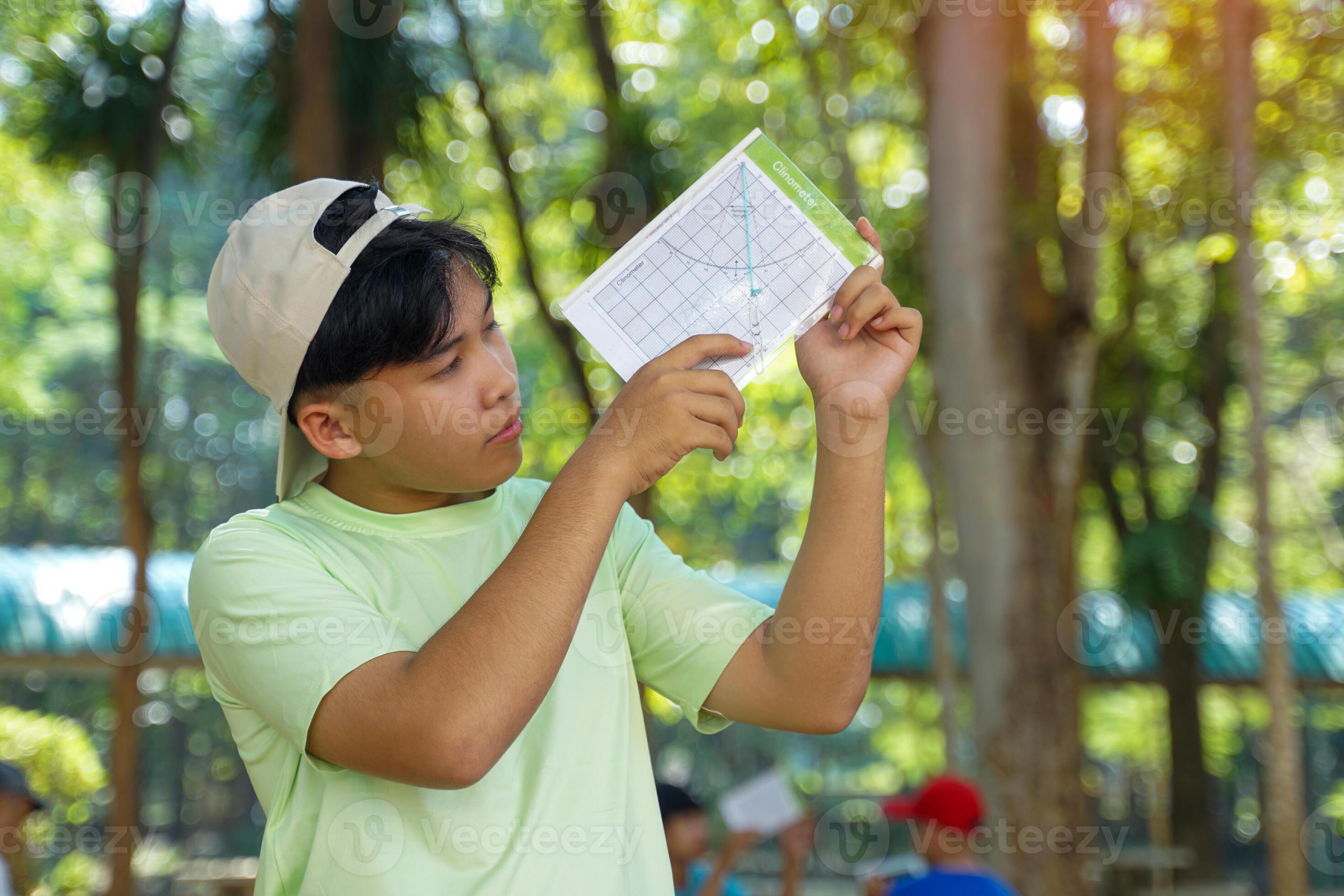 The boys used a clinometer to measure angles to calculate the height of ...