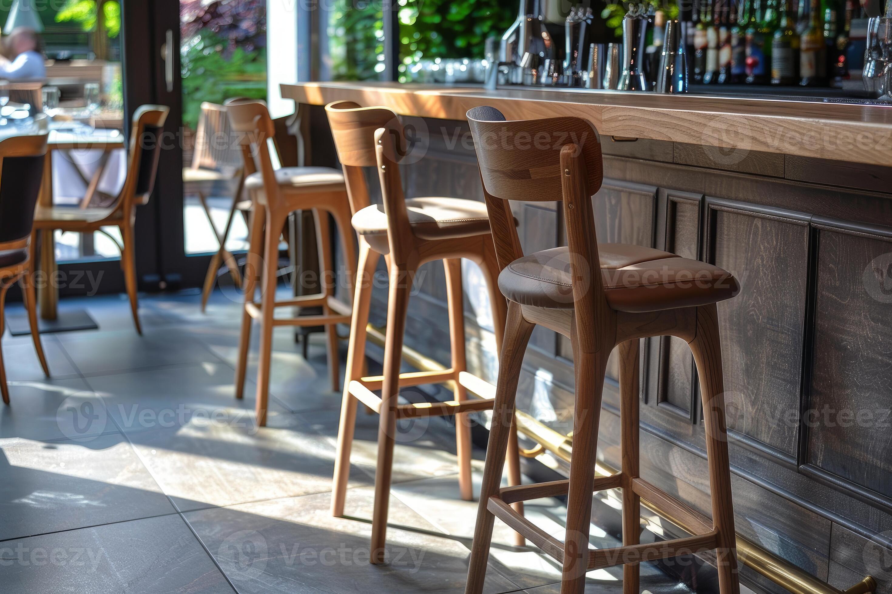 Empty bar stools bathed in sunlight in upscale restaurant 55674152 Stock Photo at Vecteezy