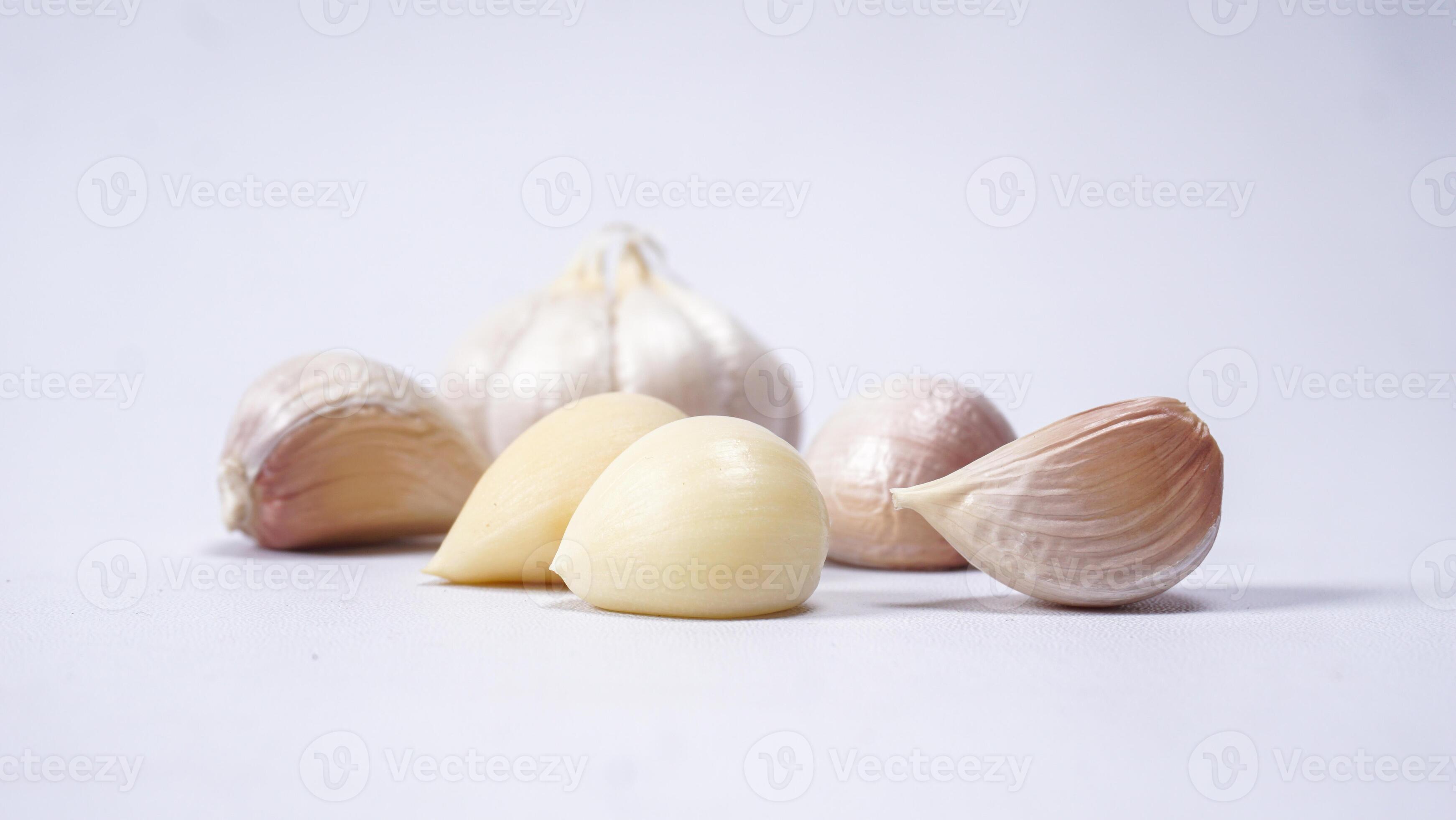 Fresh Peeled Garlic Cloves with Selective Focus on White Background 55750154 Stock Photo at Vecteezy