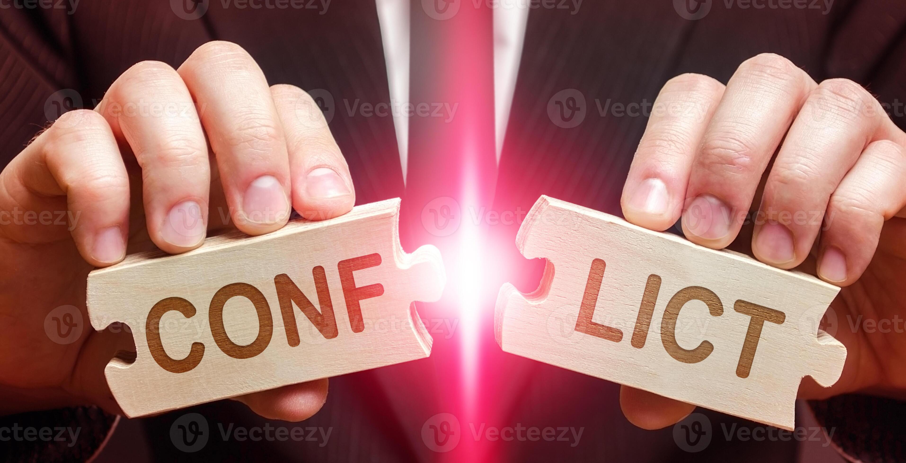 Man breaks puzzles with word Conflict. Dispute solution , compromise consensus. Overcoming ...
