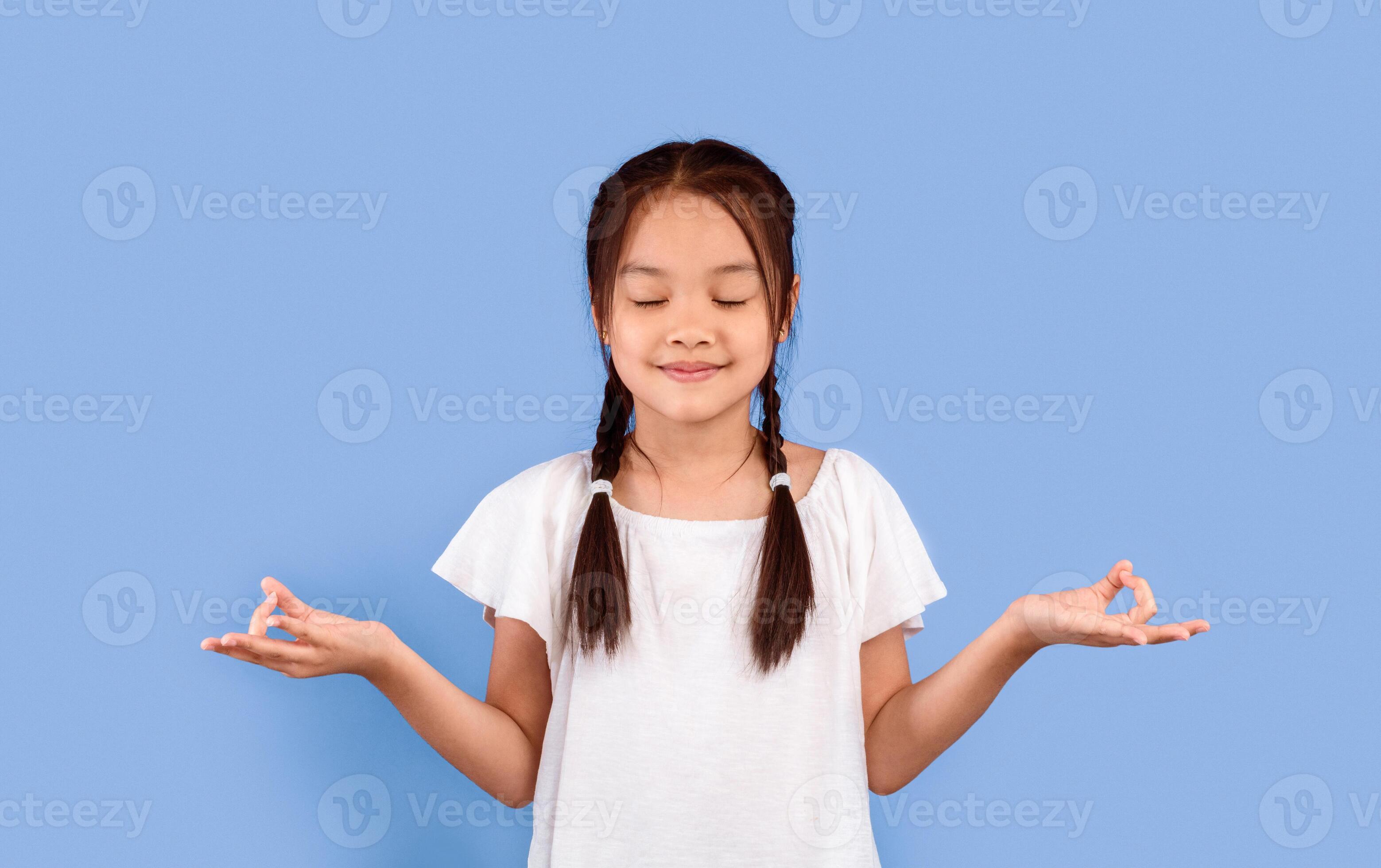 Zen. Calm Asian Kid Girl Meditating Standing Over Purple Background With Eyes Closed. Studio ...