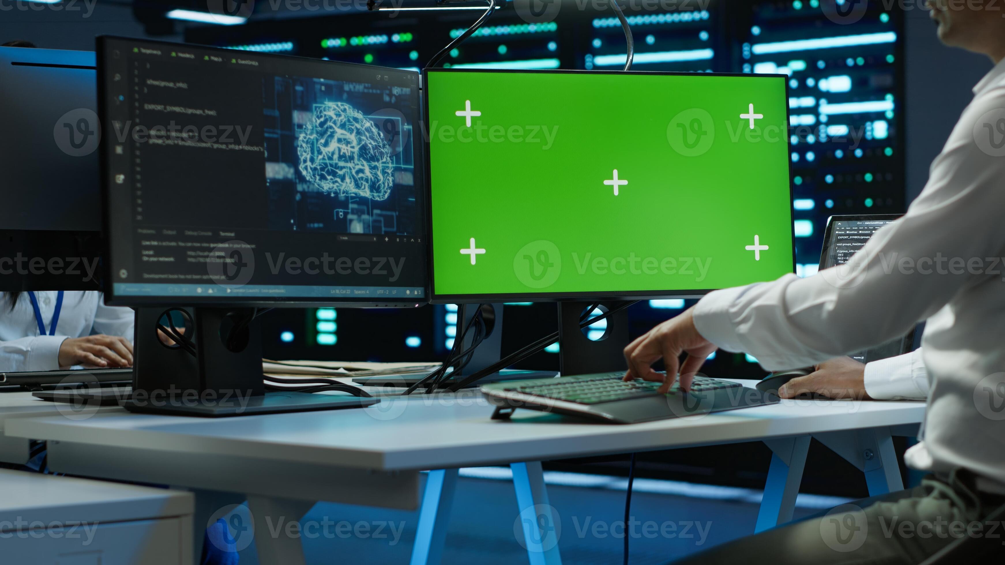 Engineer using AI tech on green screen PC to do checkup in server room. Zoom in of expert in ...