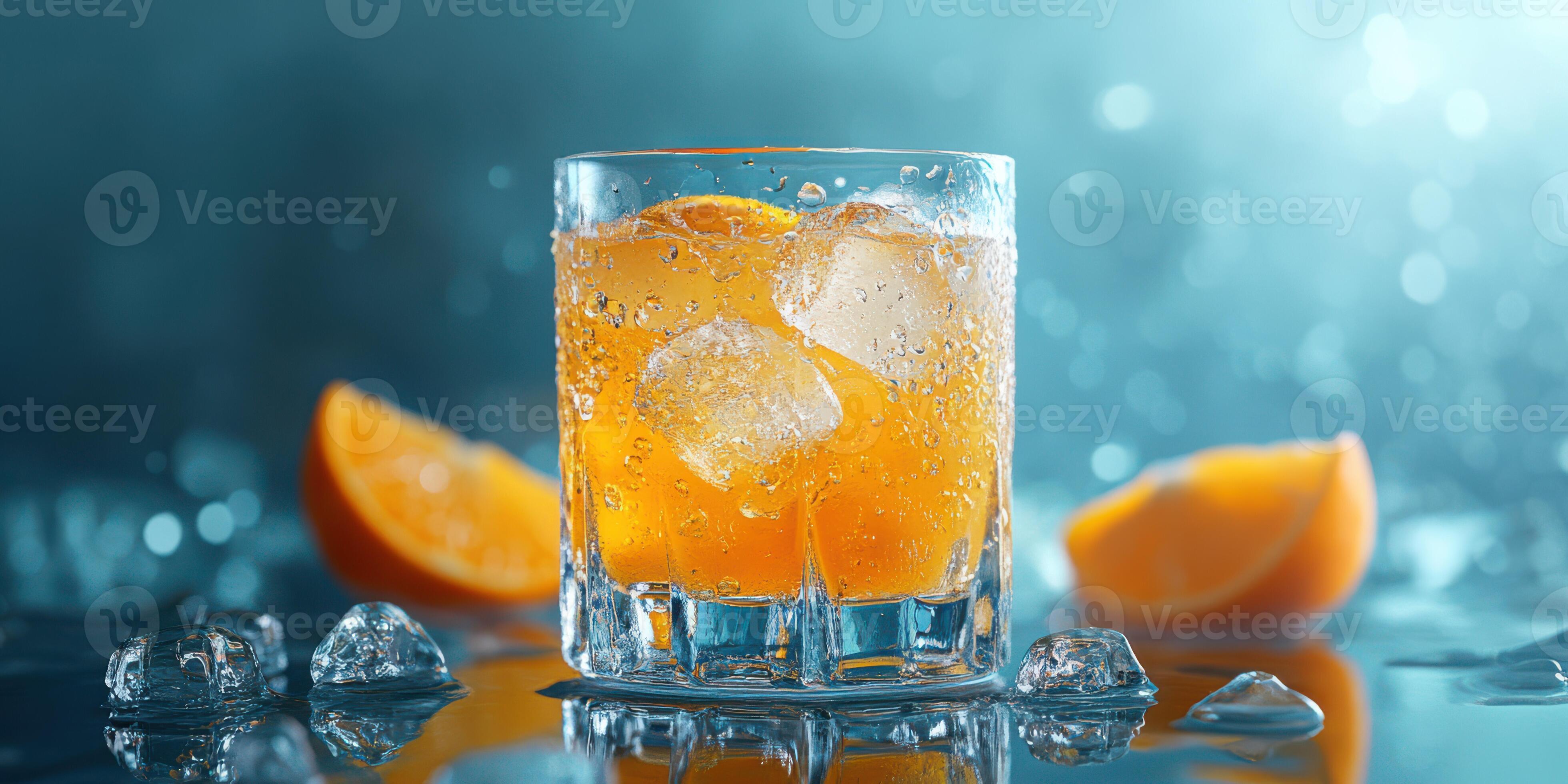 Refreshing orange drink with ice in a glass surrounded by orange slices 56339580 Stock Photo at ...