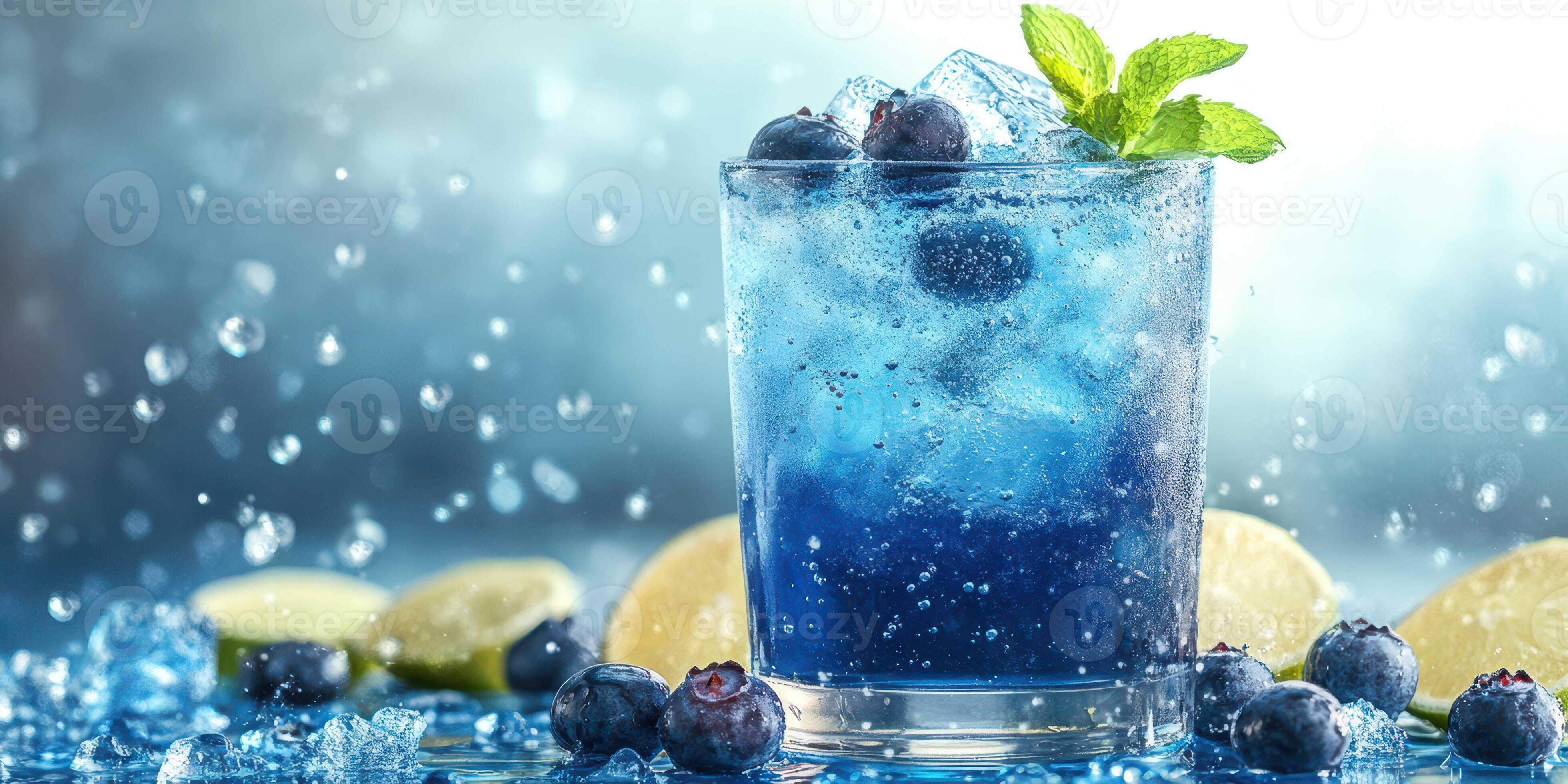 Refreshing blueberry cocktail with mint and ice served in a glass on a vibrant summer day ...