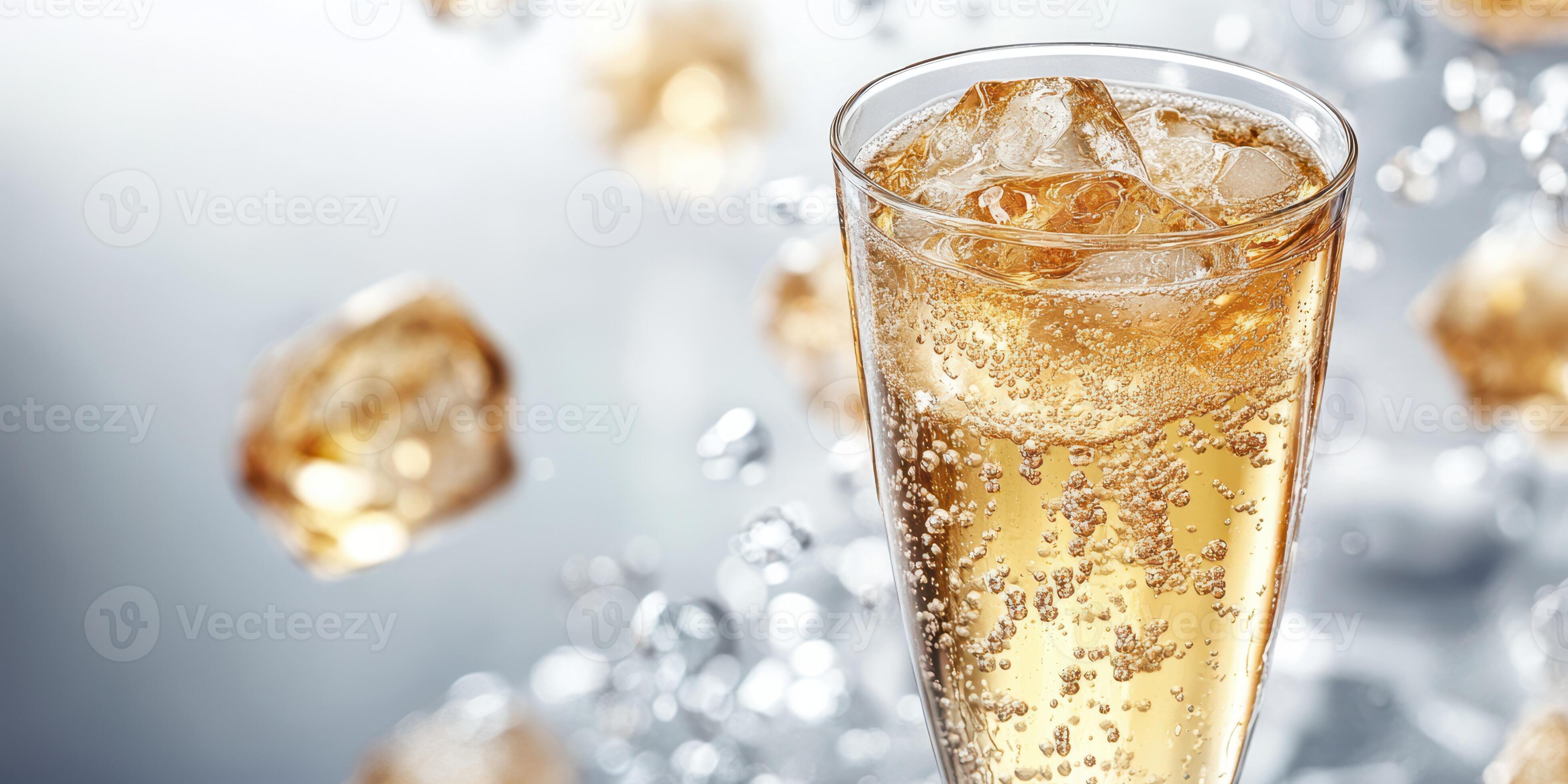 Sparkling beverage with ice in a clear glass, showcasing refreshing bubbles and a vibrant ...