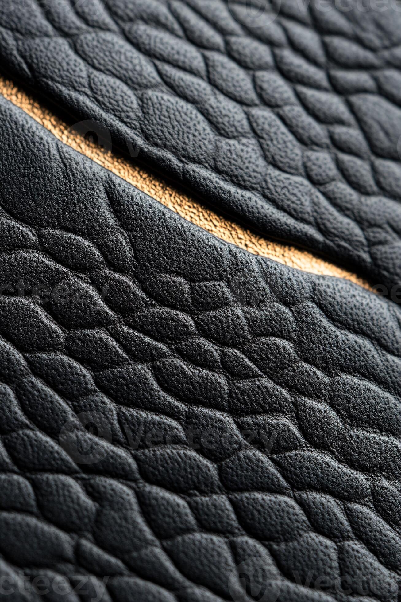 Rich black leather showcases intricate embossed patterns and subtle ...