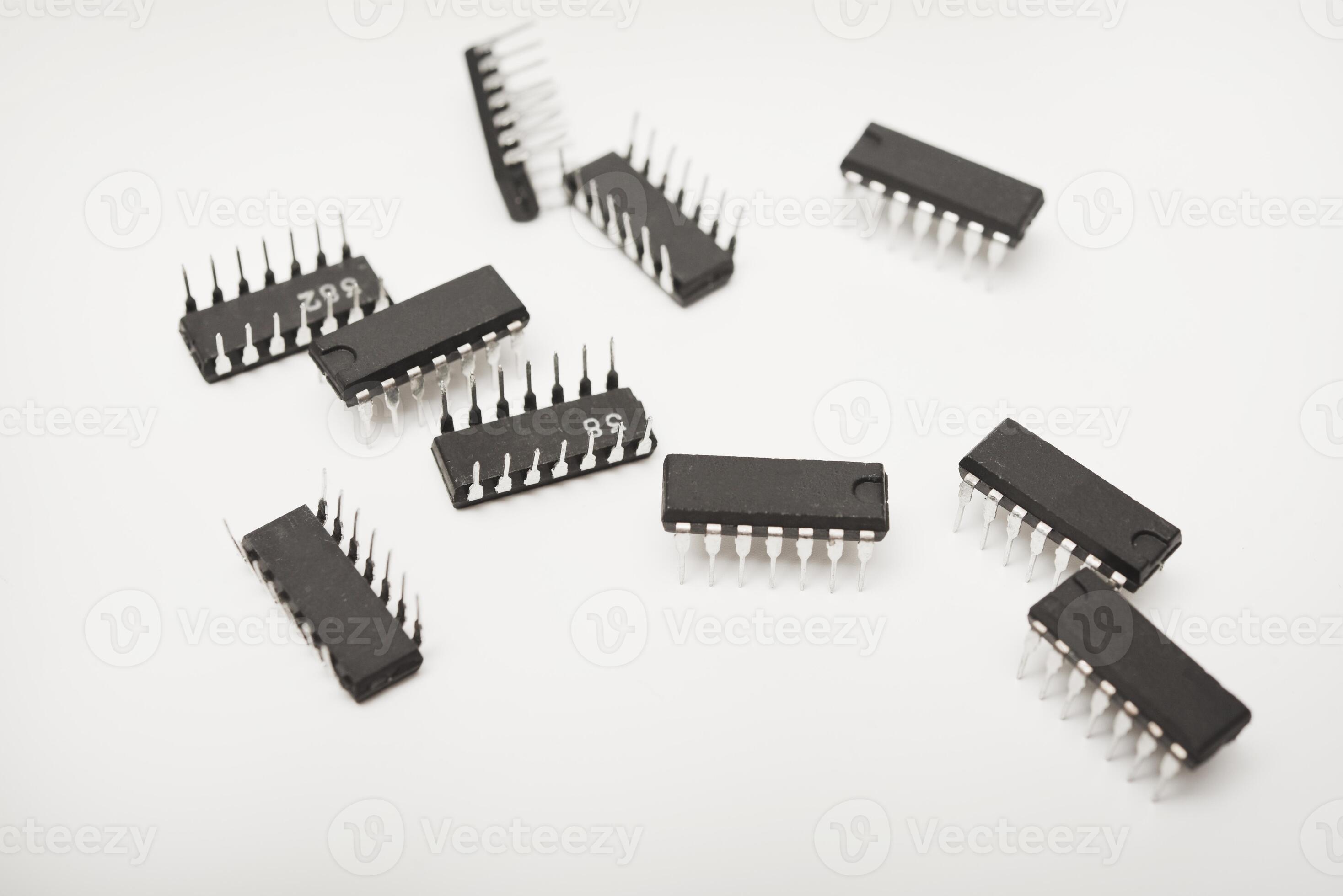 A microcontroller on a white background. electronic chip in a plastic ...
