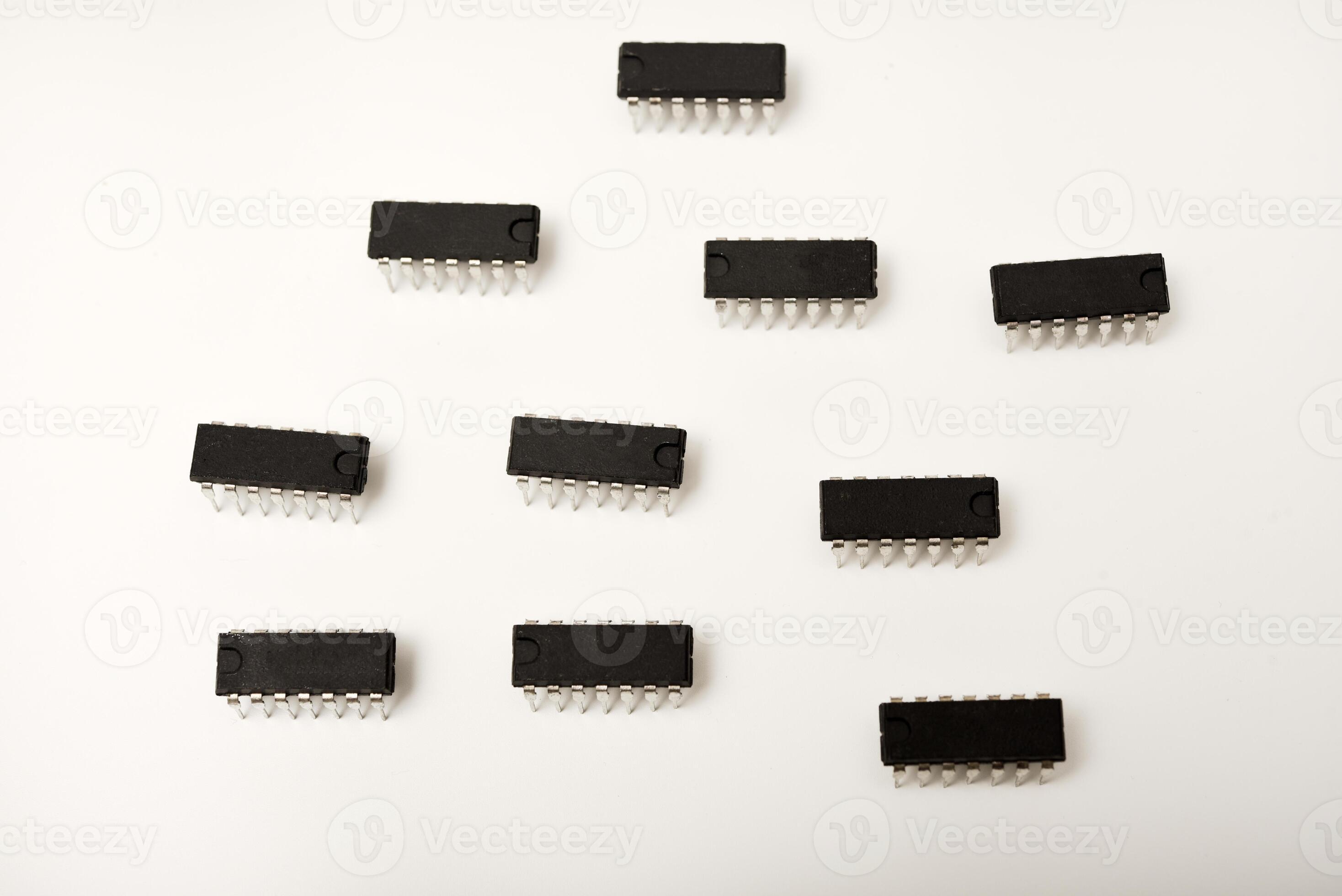 A microcontroller white background. An electronic chip in a plastic ...