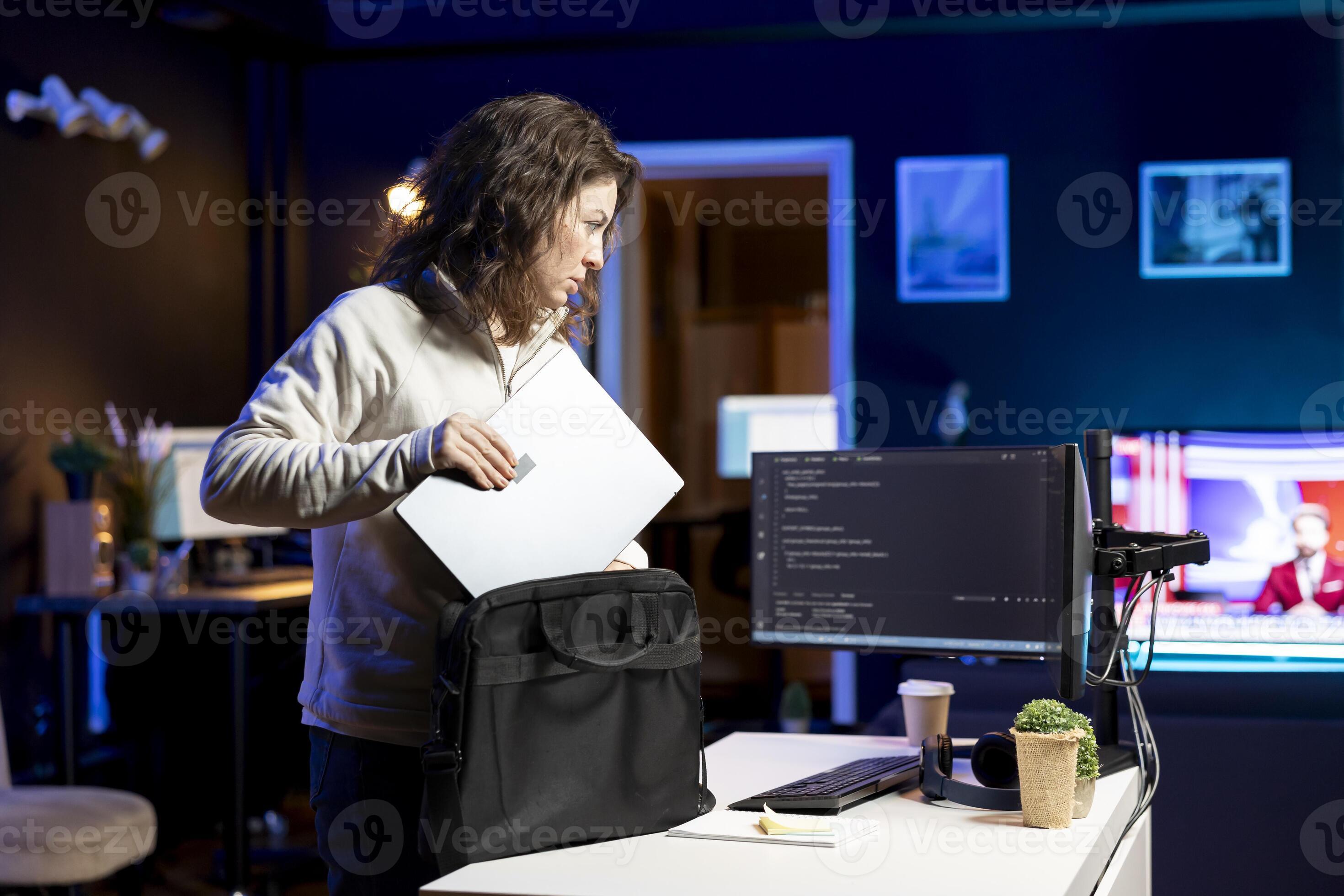 Woman Packing Laptop After Finishing Doing Software Quality Assurance And Reading Source Code