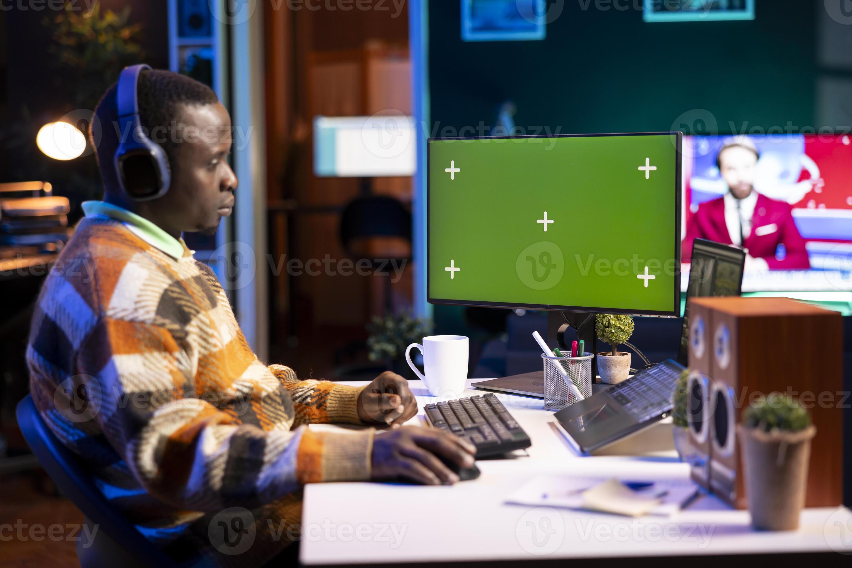 Videographer Creating Visual Effects On Montage Next To Green Screen Working On Color