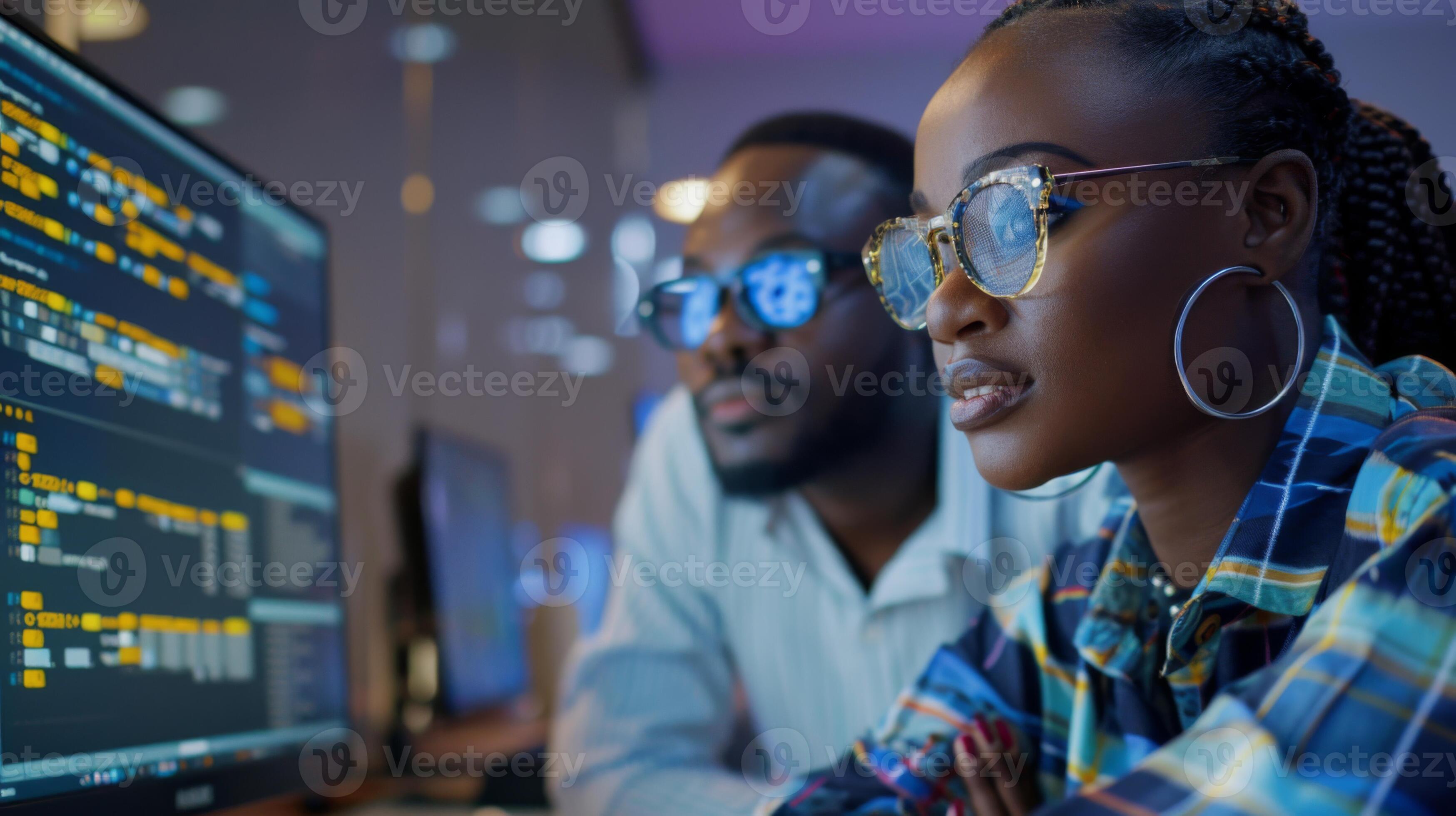 Two Professionals Focus Intently On Coding Surrounded By Computer Screens Displaying Data In A