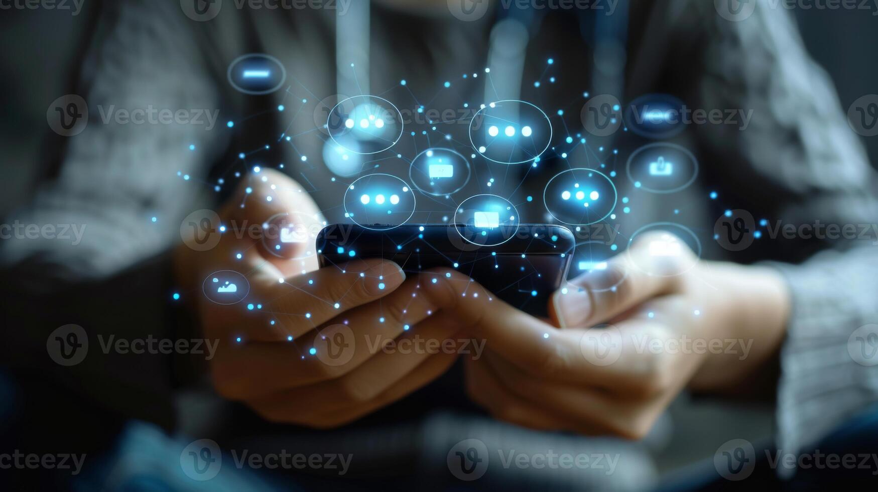 Hands interact with a smartphone displaying various digital communication icons, symbolizing ...