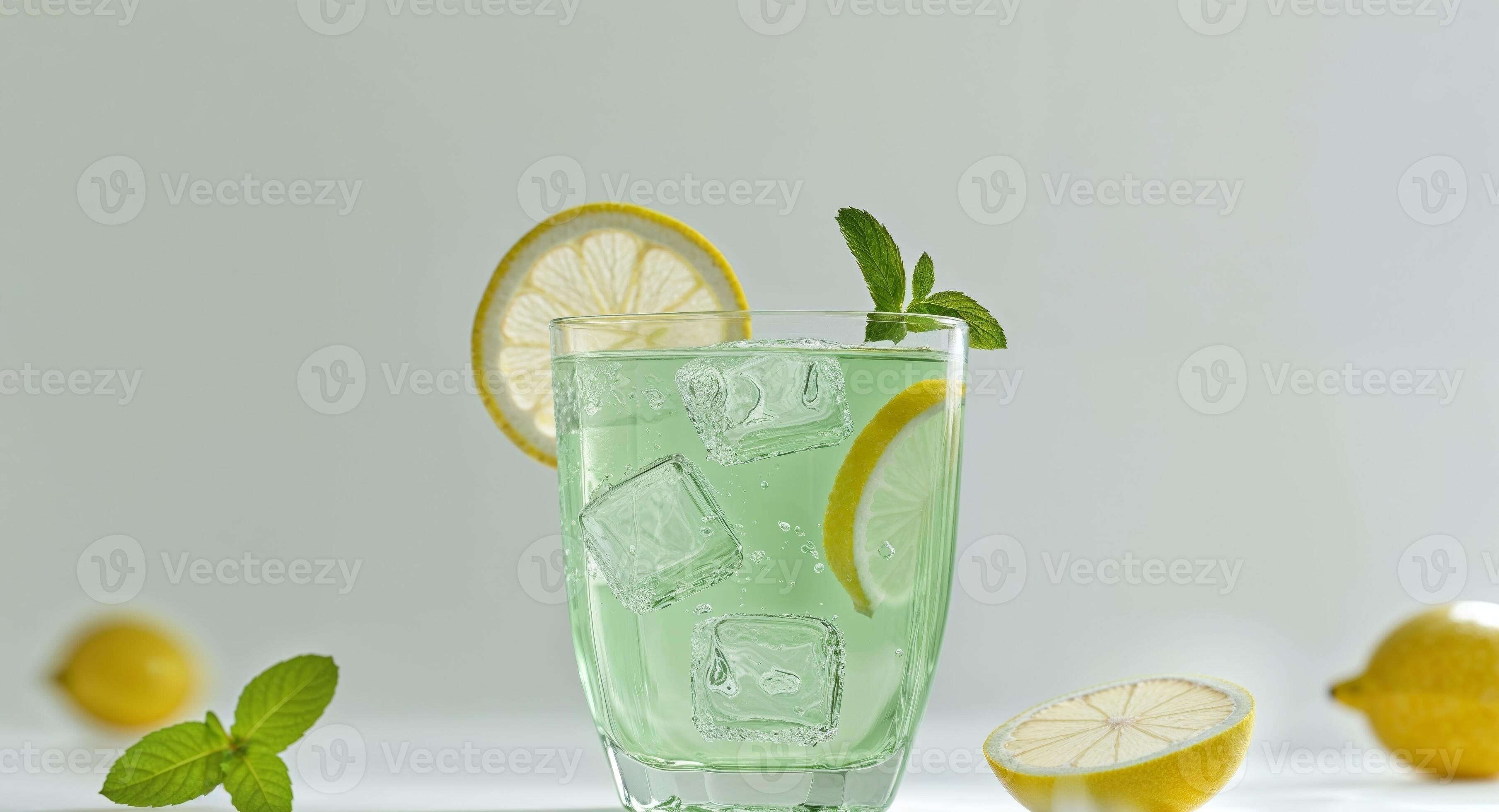 A glass of cold tea ice cubes lemon slices and a sprig of mint cooling summer drinks. 56716113 ...