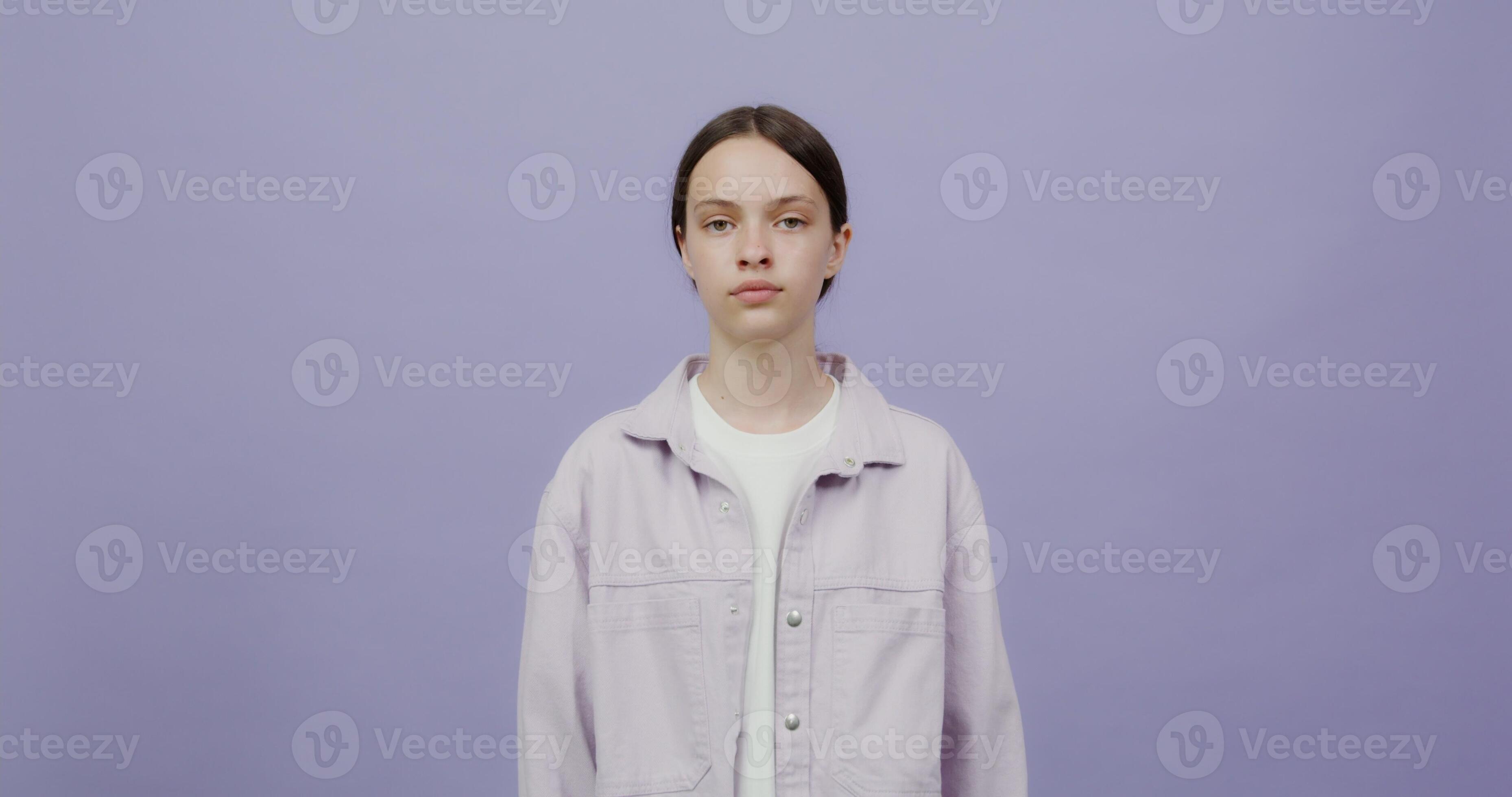 A beautiful young woman of European appearance is embarrassed, uncomfortable, embarrassed ...