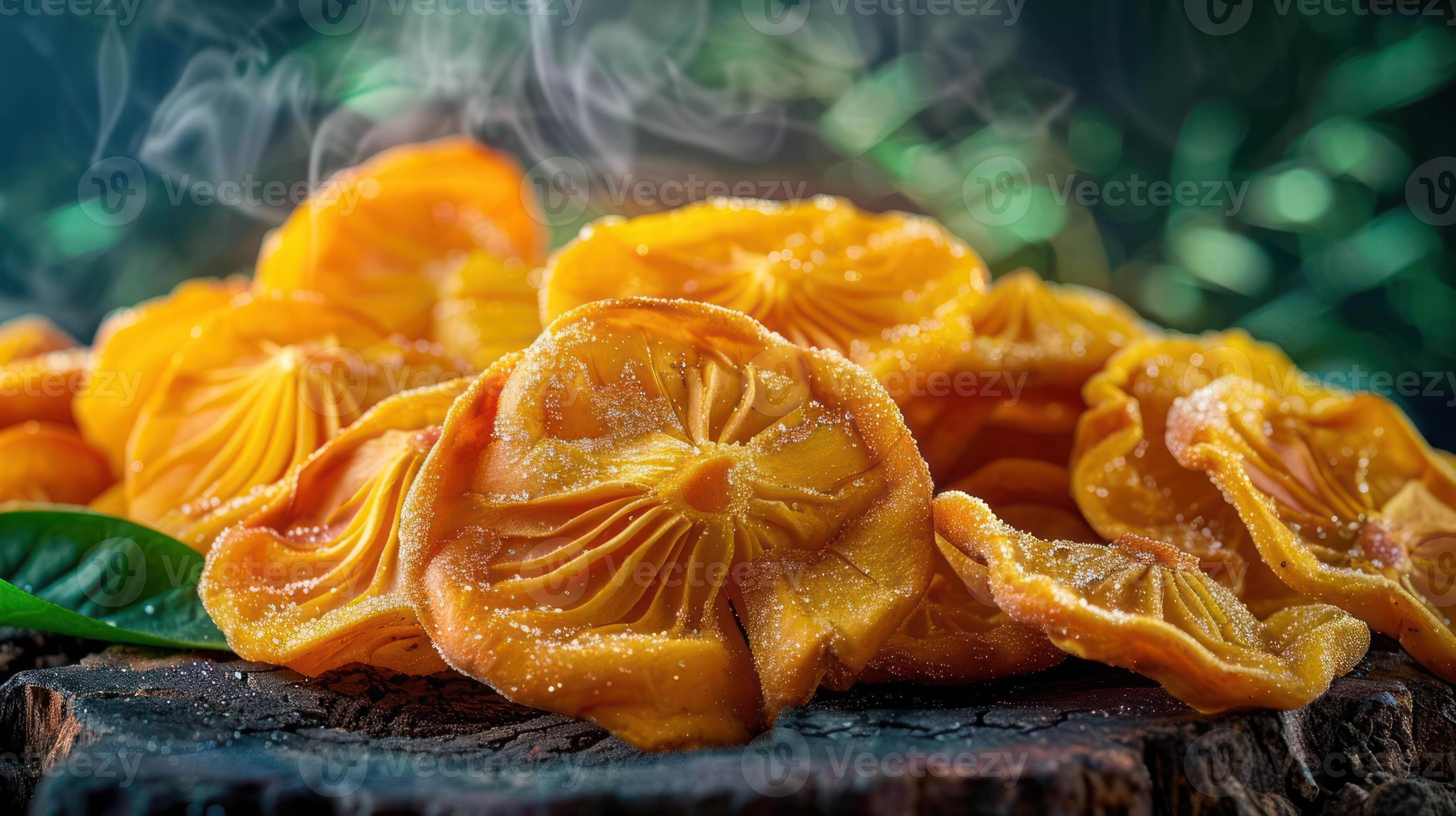 A vibrant display of dried fruit slices on a rustic wooden surface with a smoky background ...