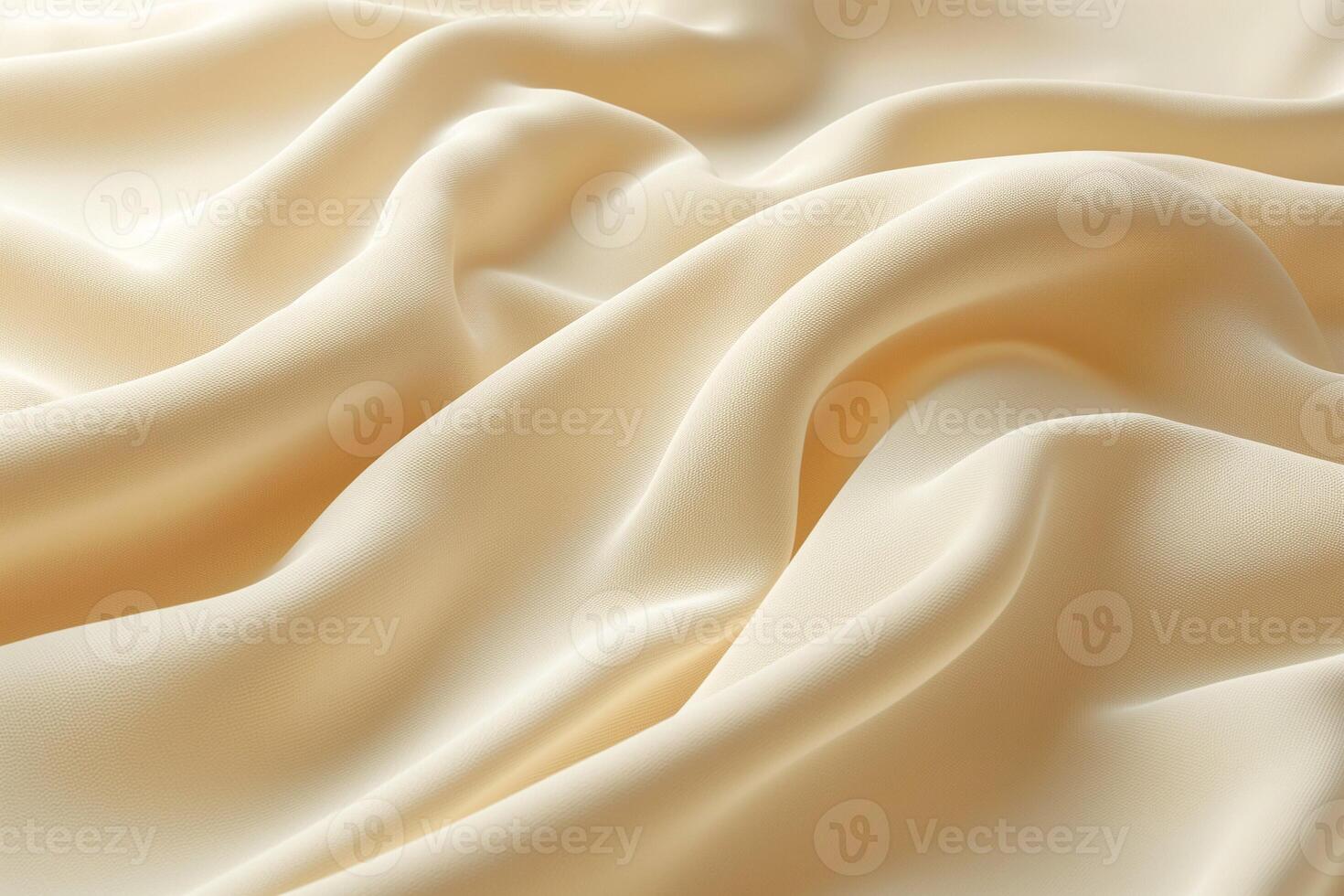 A close-up view of flowing cream-colored silk fabric, showcasing its smooth texture and elegant ...