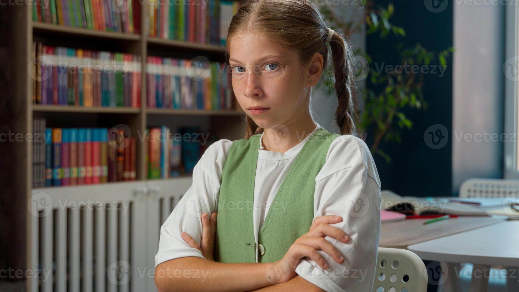 Sad tired offended Caucasian little girl school child kid pupil schoolgirl student primary ...