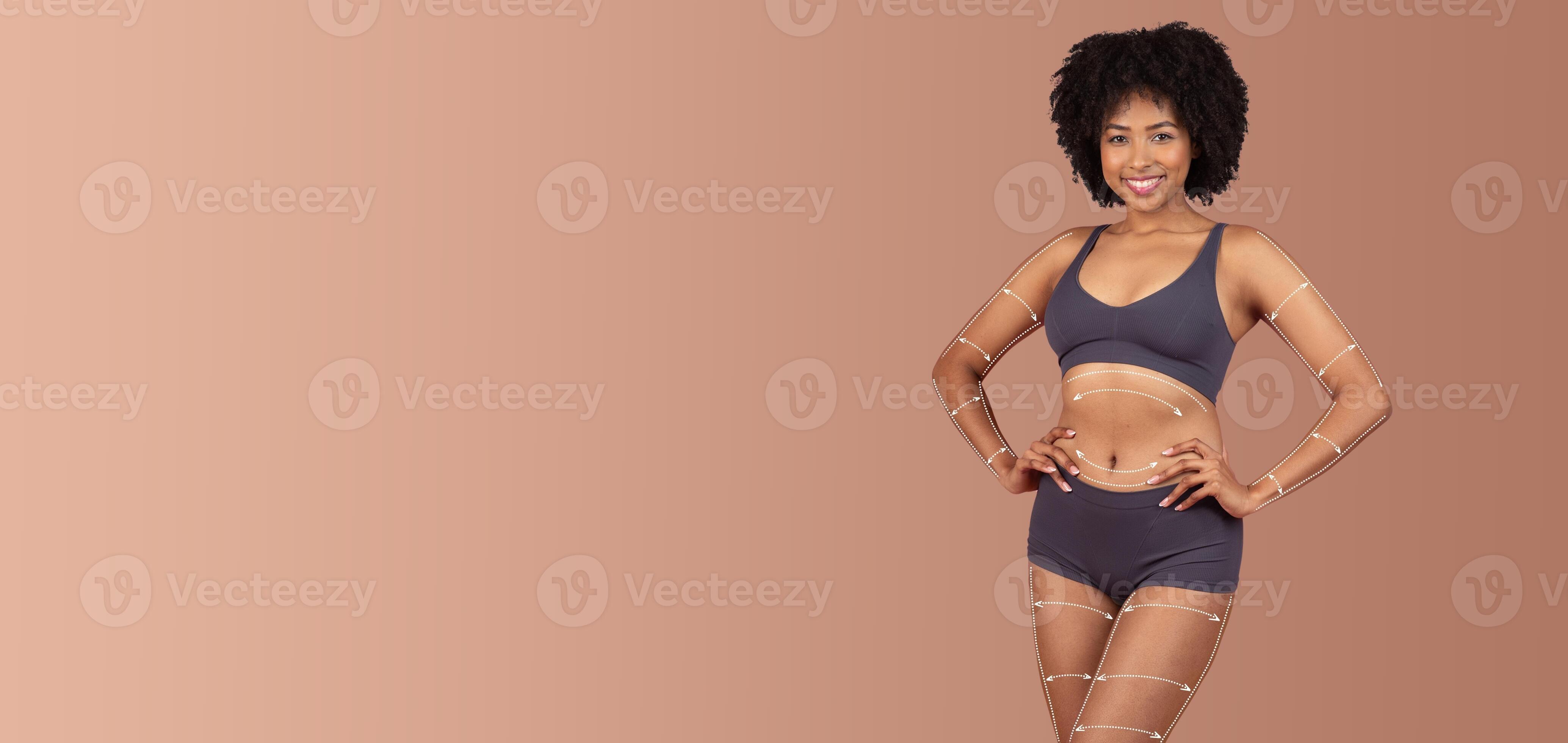 African American woman stands confidently in a fitted outfit, highlighting her feminine curves ...