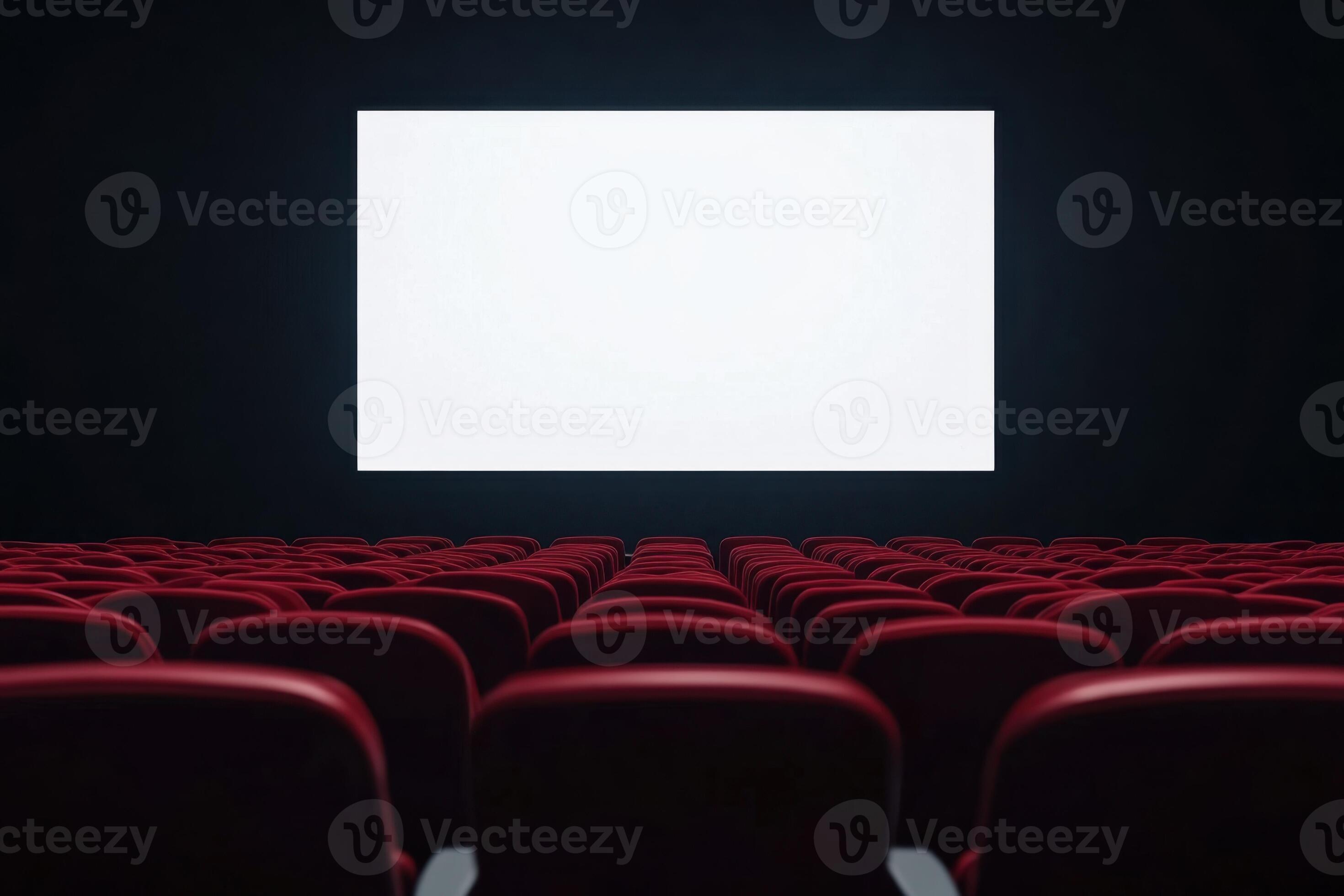 Empty cinema auditorium with rows of red seats facing a blank white screen, awaiting the show ...