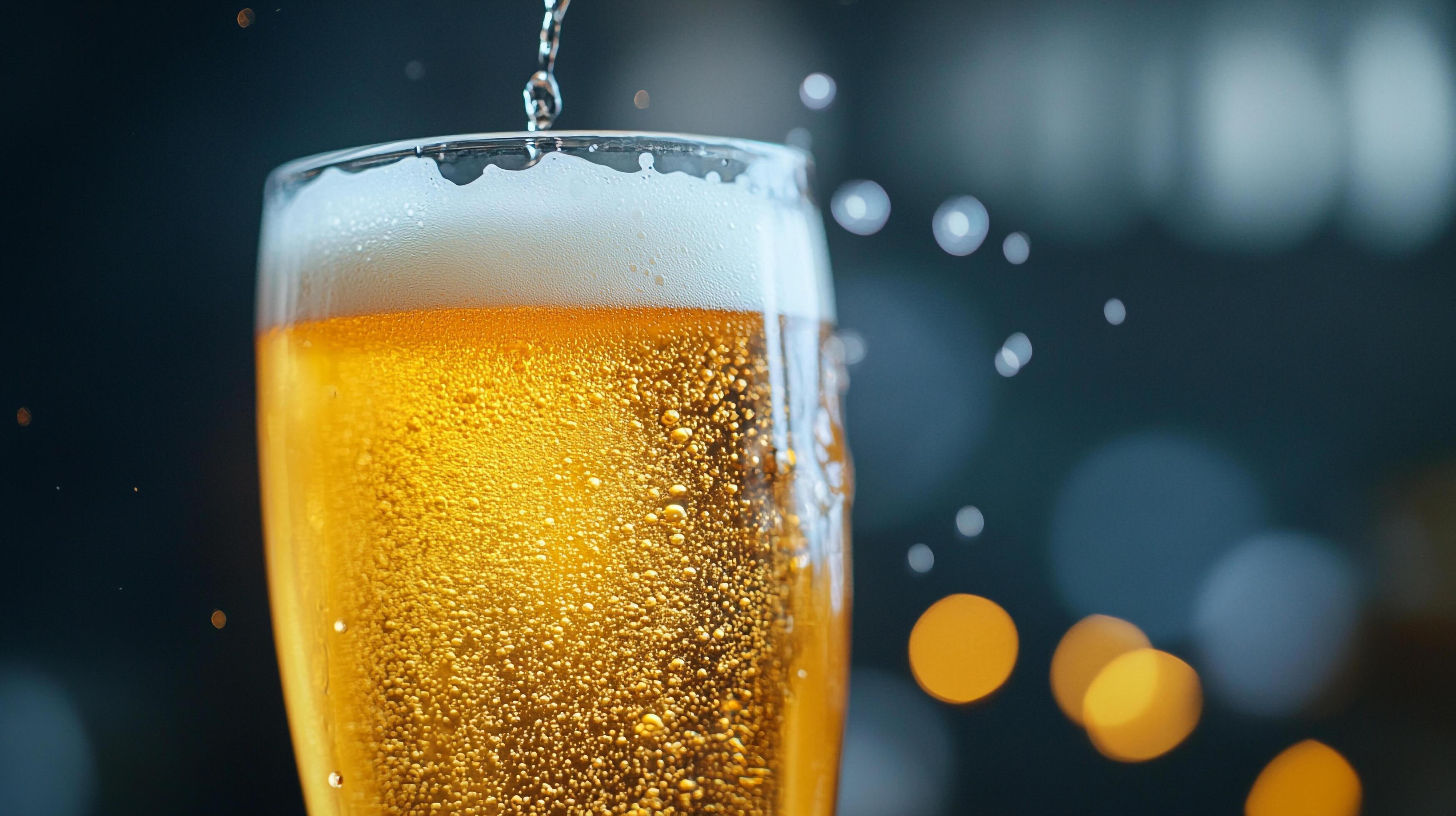 Refreshing drink being poured into a glass, with visible bubbles and condensation, creating a ...