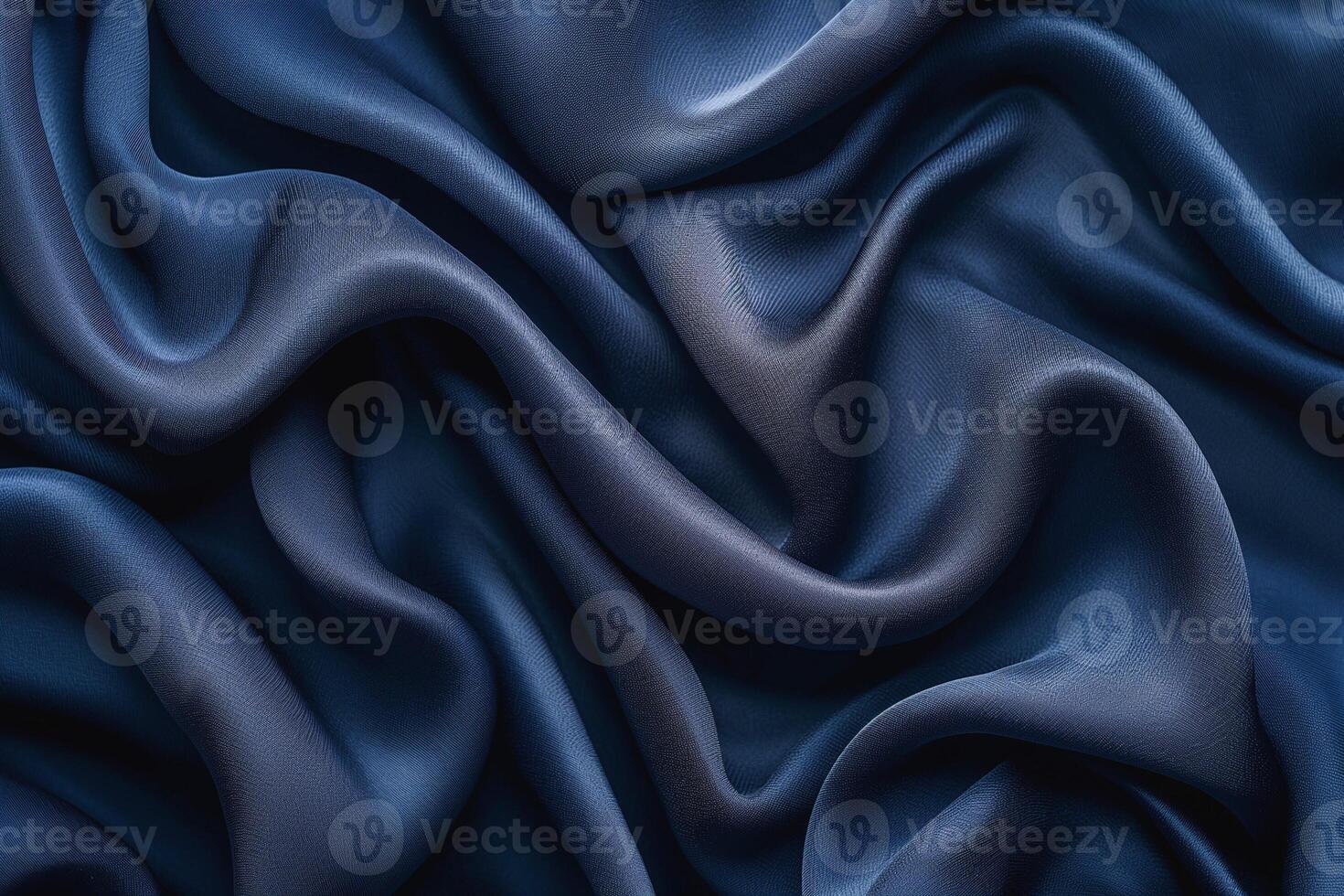 Elegant deep blue silk fabric with soft, flowing folds creating a luxurious texture. 57263425 ...