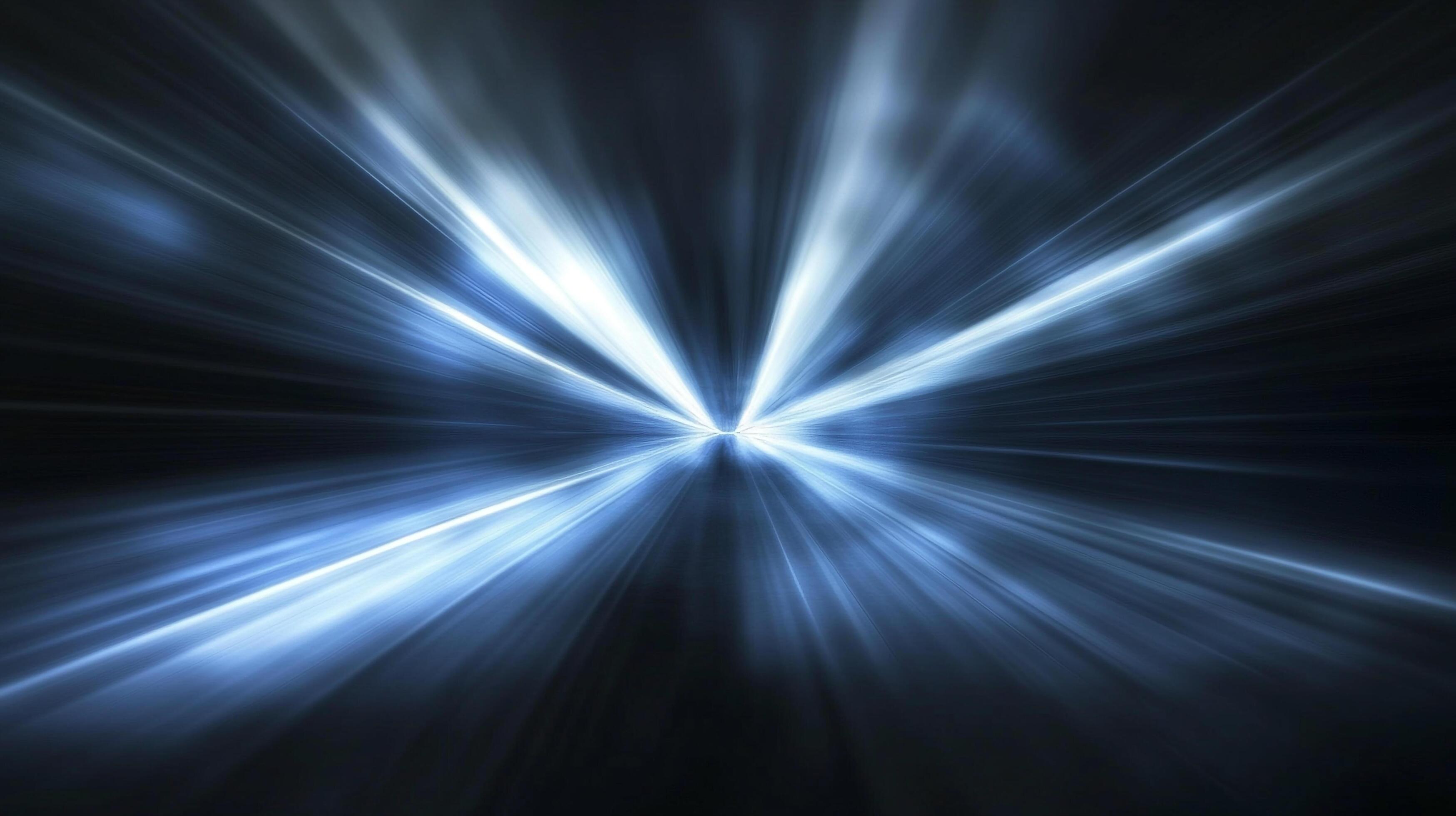 Abstract image with a central point emanating blue and white light rays against a dark ...