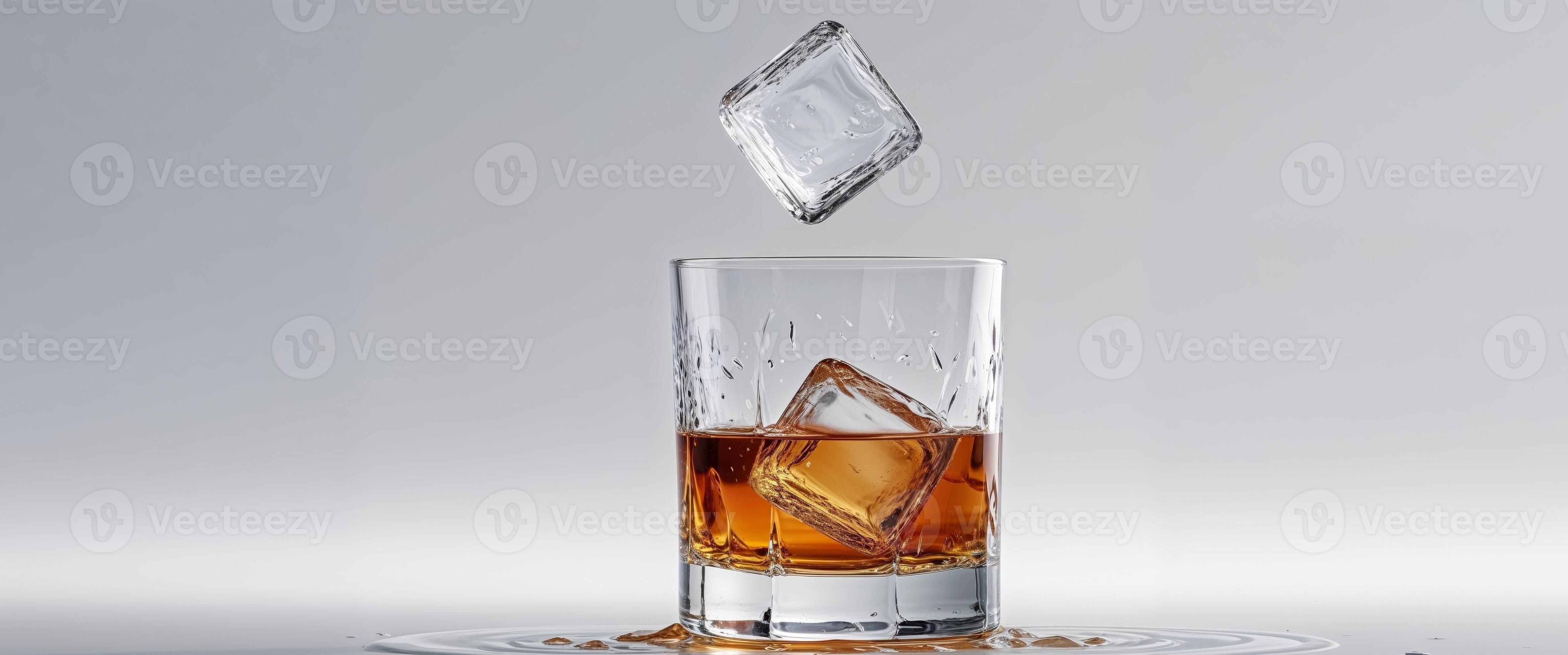 Ice Cube Falling into Whiskey in Rocks Glass 57496349 Stock Photo at Vecteezy