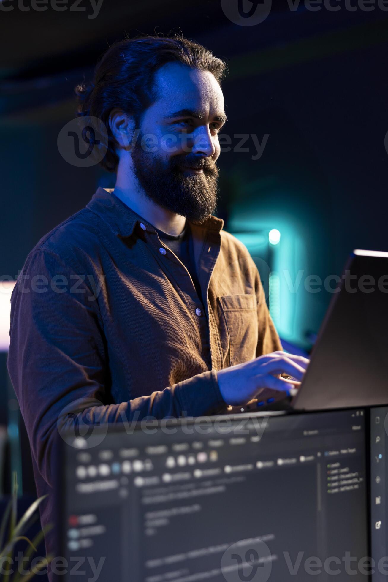 Joyful Freelancer Doing Software Debugging Using Laptop Checking Errors In Lines Of Code