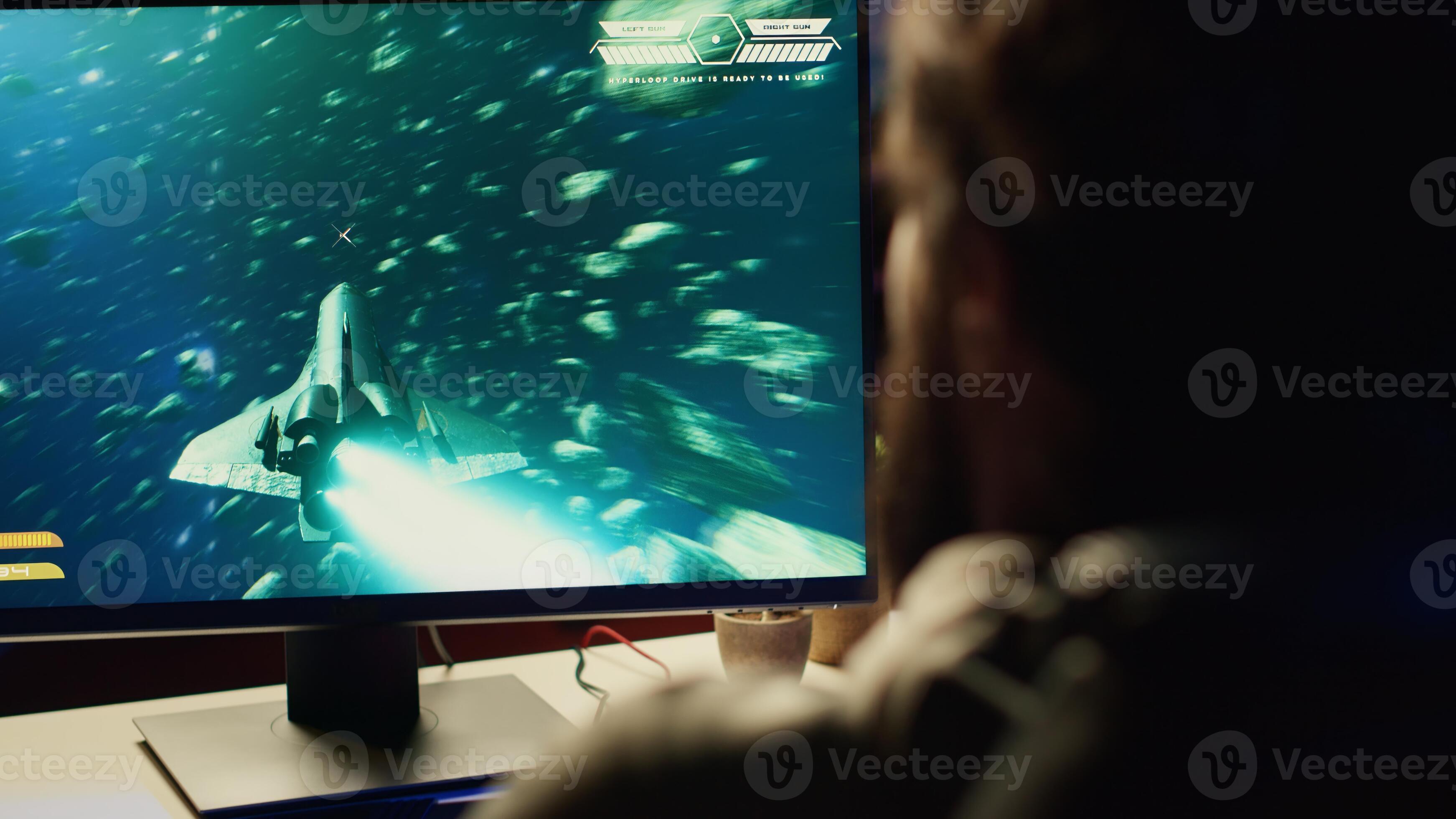 Man playing high FPS singleplayer videogame with spaceship shooting laser streams at asteroid ...