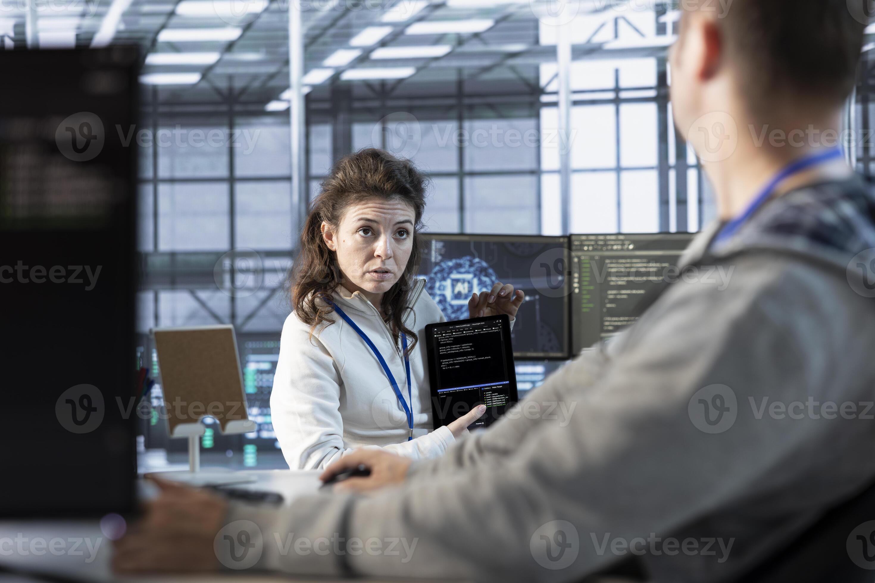 Programmers Using Tablet In Data Center Coordinating Deployment Of Server Architecture