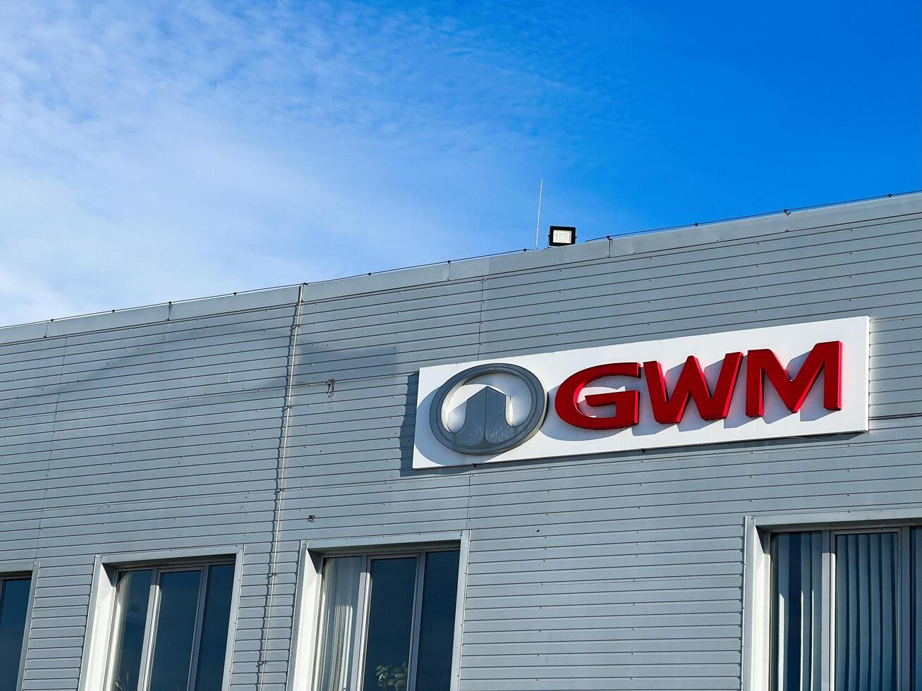 Kyiv, Ukraine - March 04, 2025- Modern industrial building facade with large GWM company logo ...
